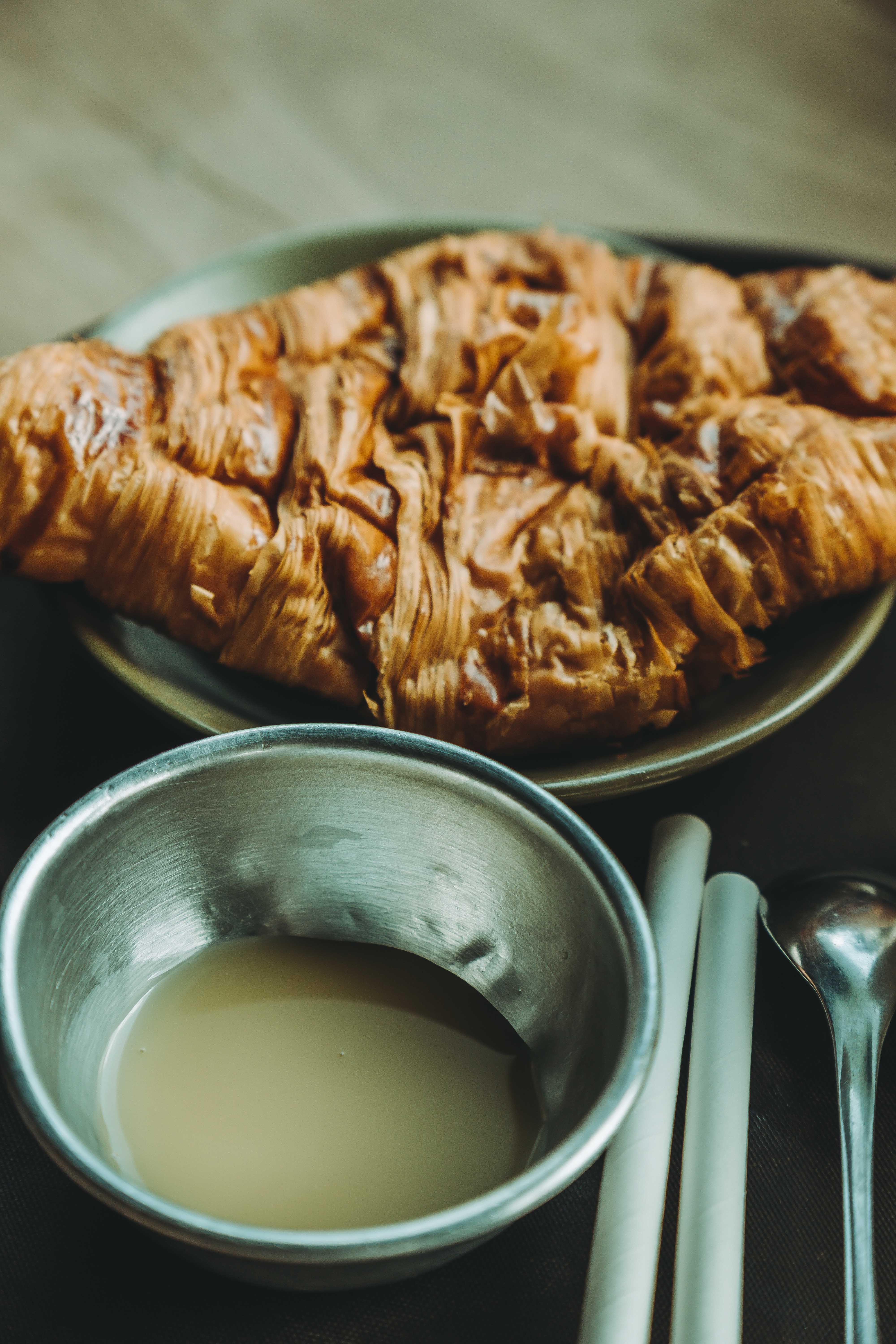 A bowl of croissant and a cup of coffee · Free Stock Photo