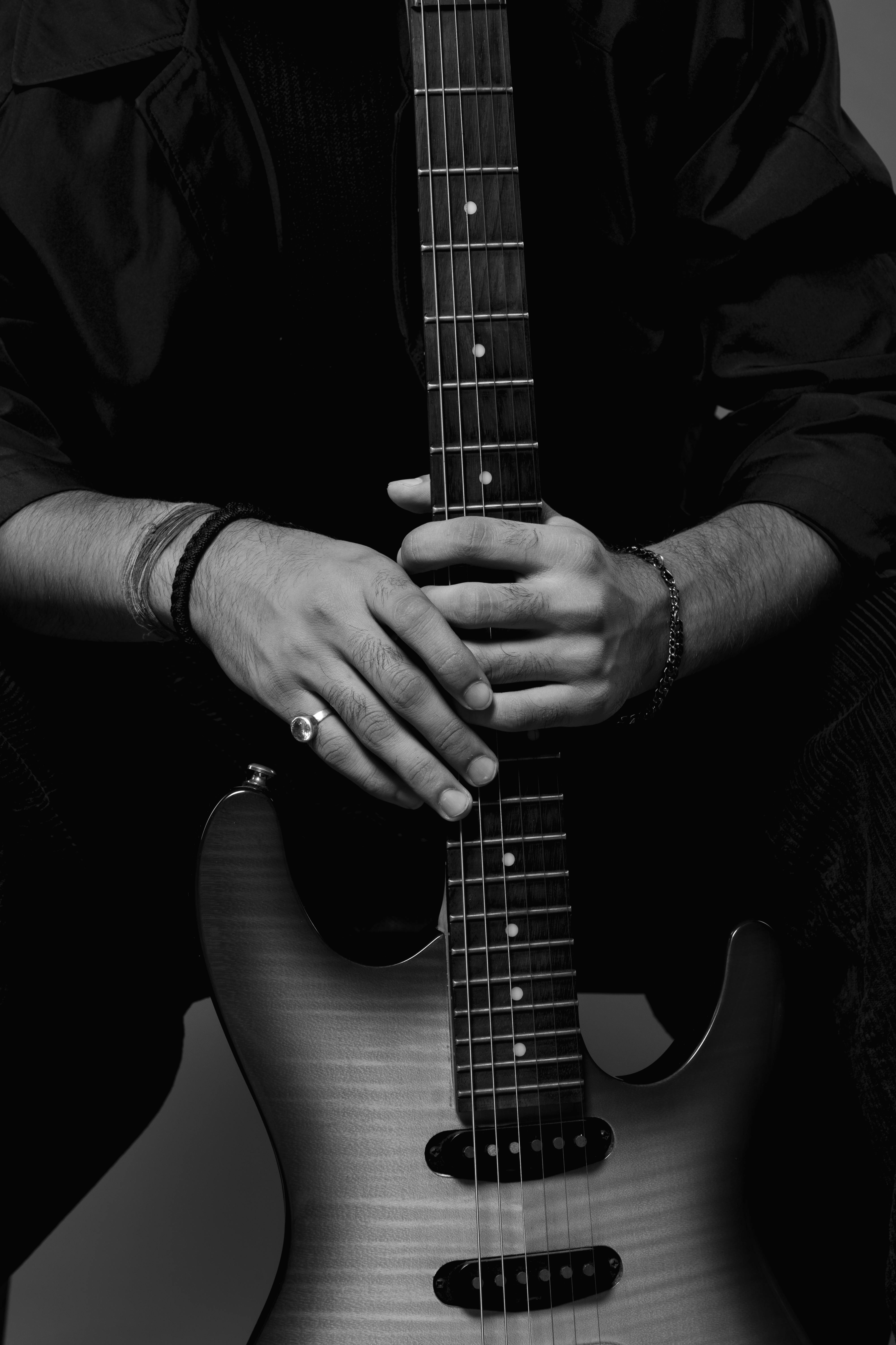 Man Hands Holding Electric Guitar · Free Stock Photo