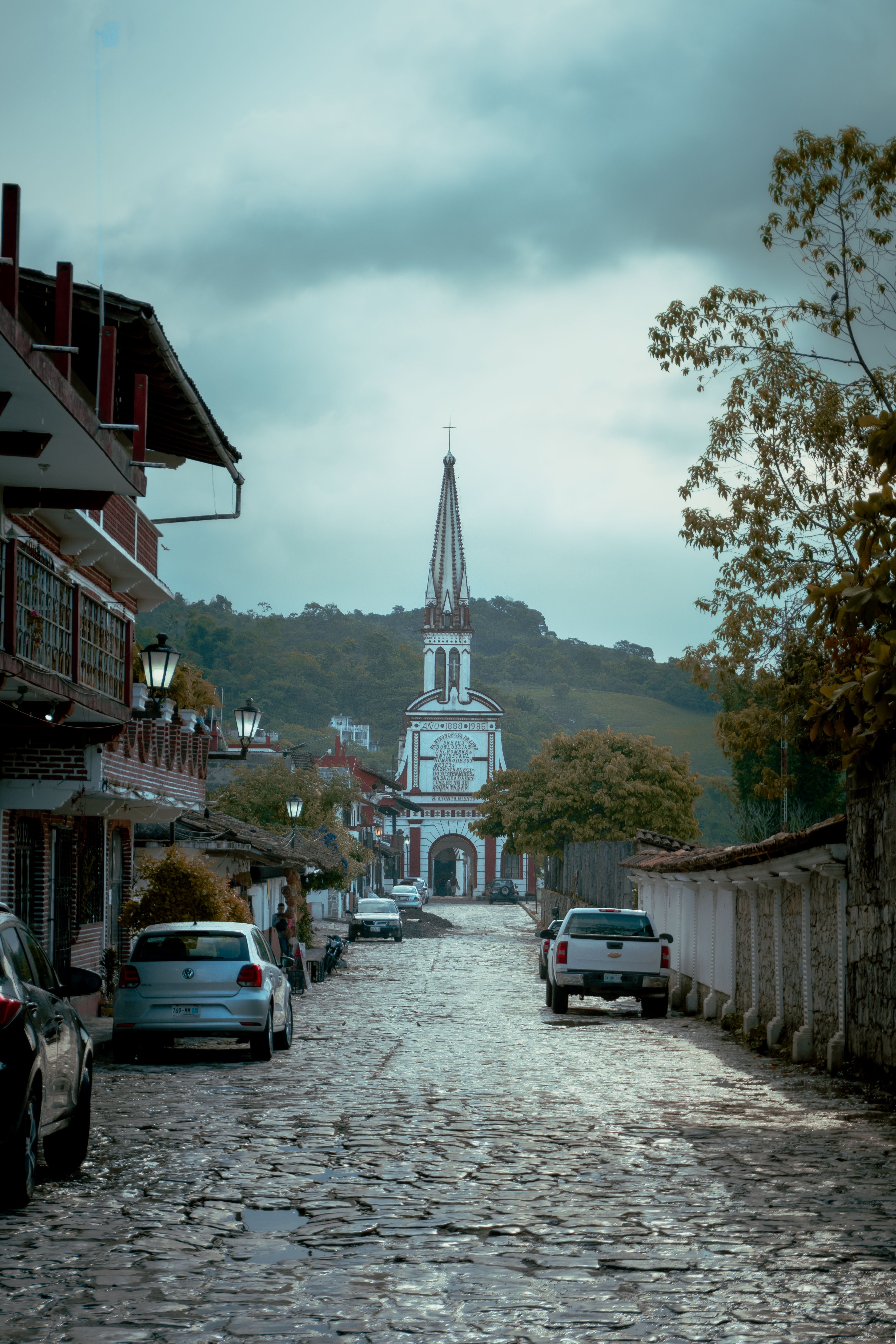 A cobblestone street with a church on top · Free Stock Photo