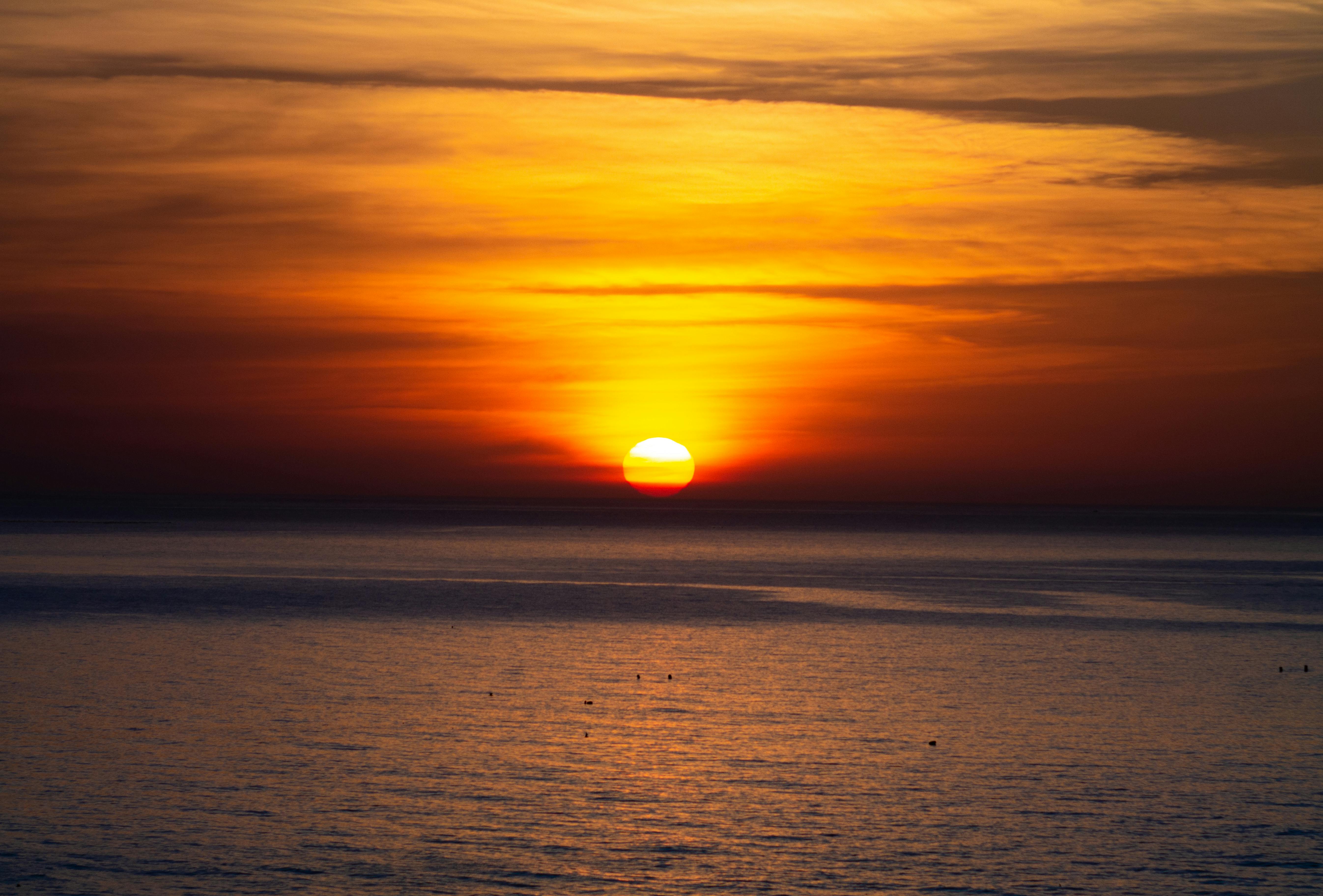 Yellow Sky over Open Sea at Sunset · Free Stock Photo