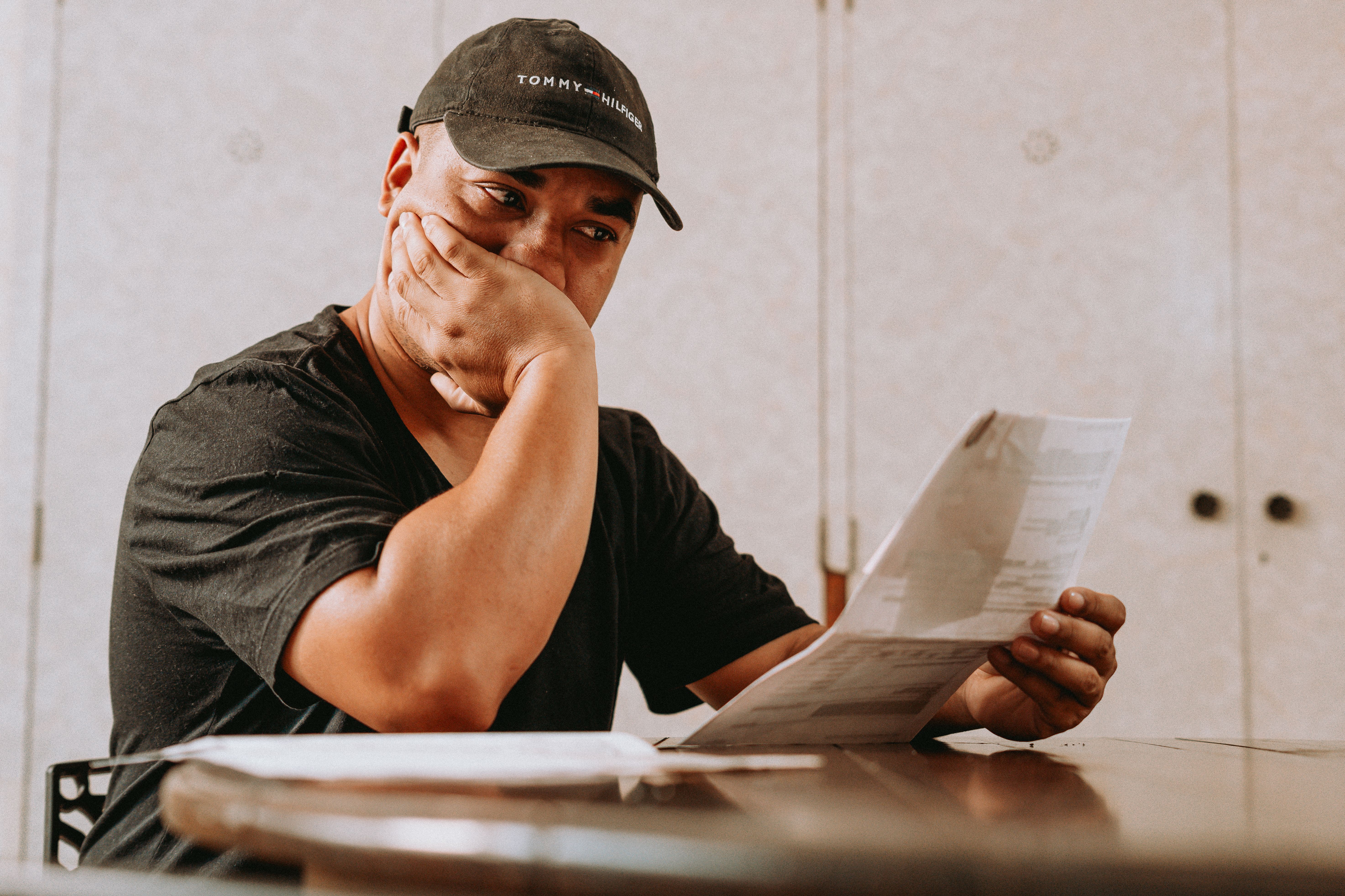 Worried Father Looking on Child School Grades · Free Stock Photo