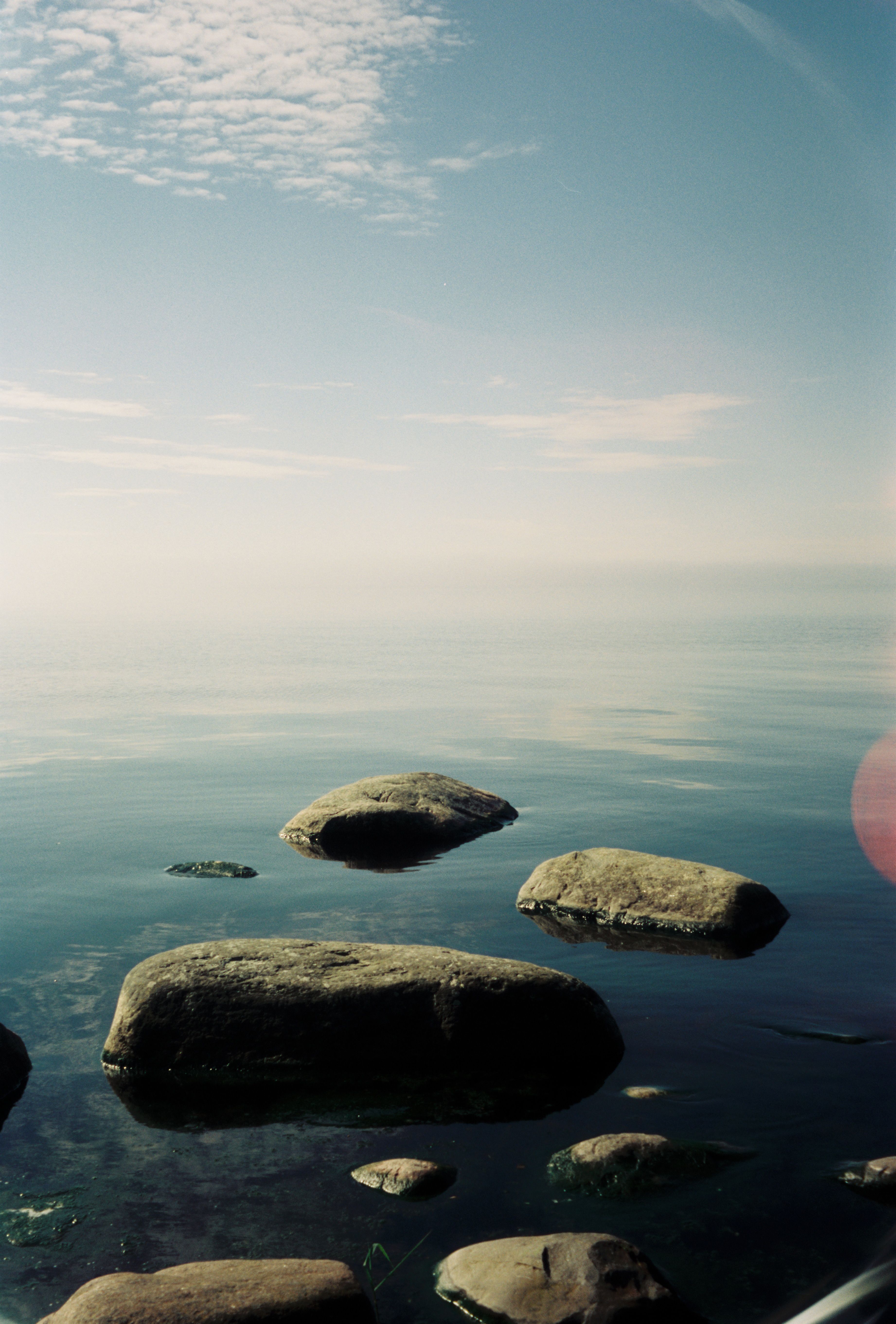 Serene Ocean View with Rocky Shoreline · Free Stock Photo