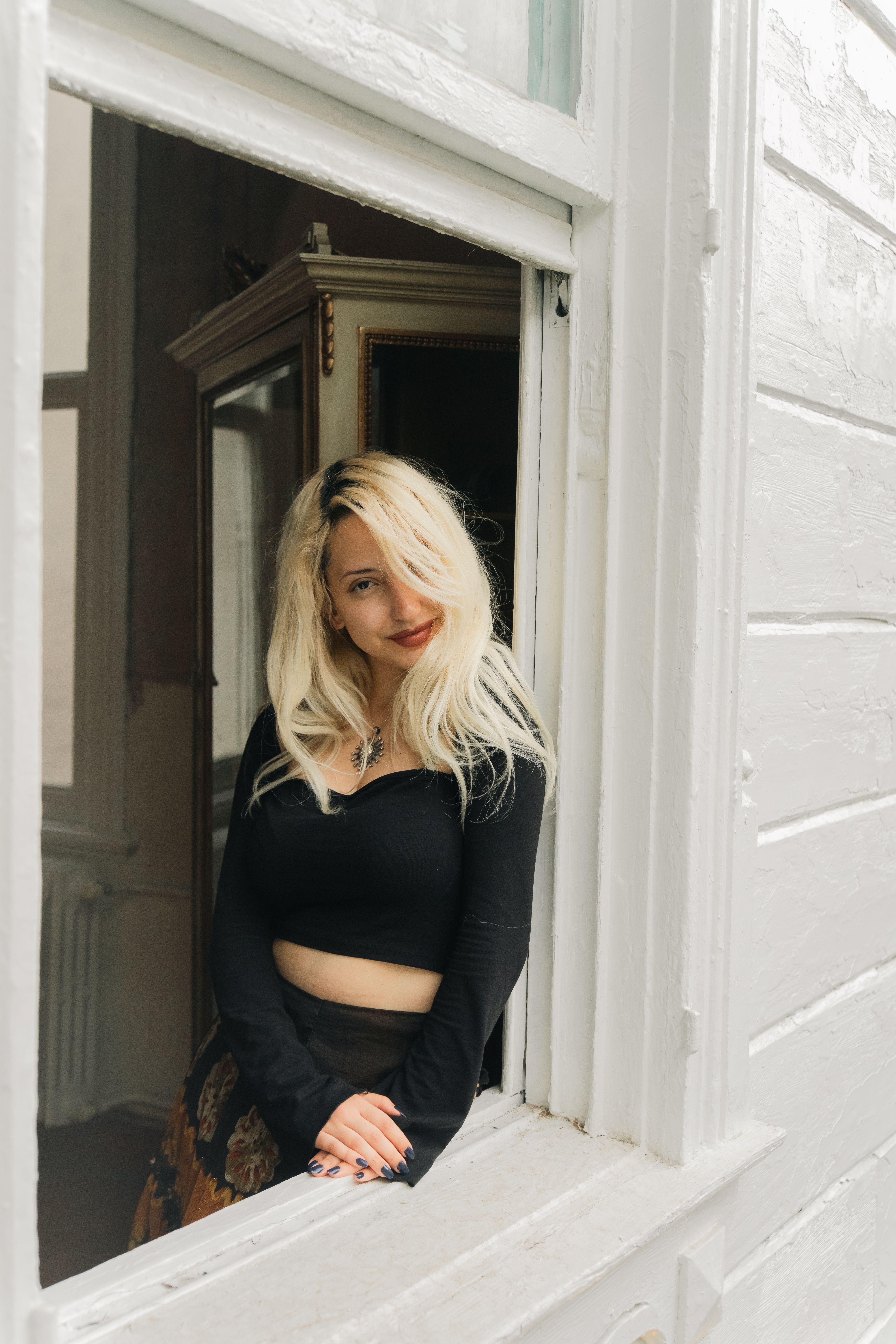 Portrait of a Woman in a Window · Free Stock Photo