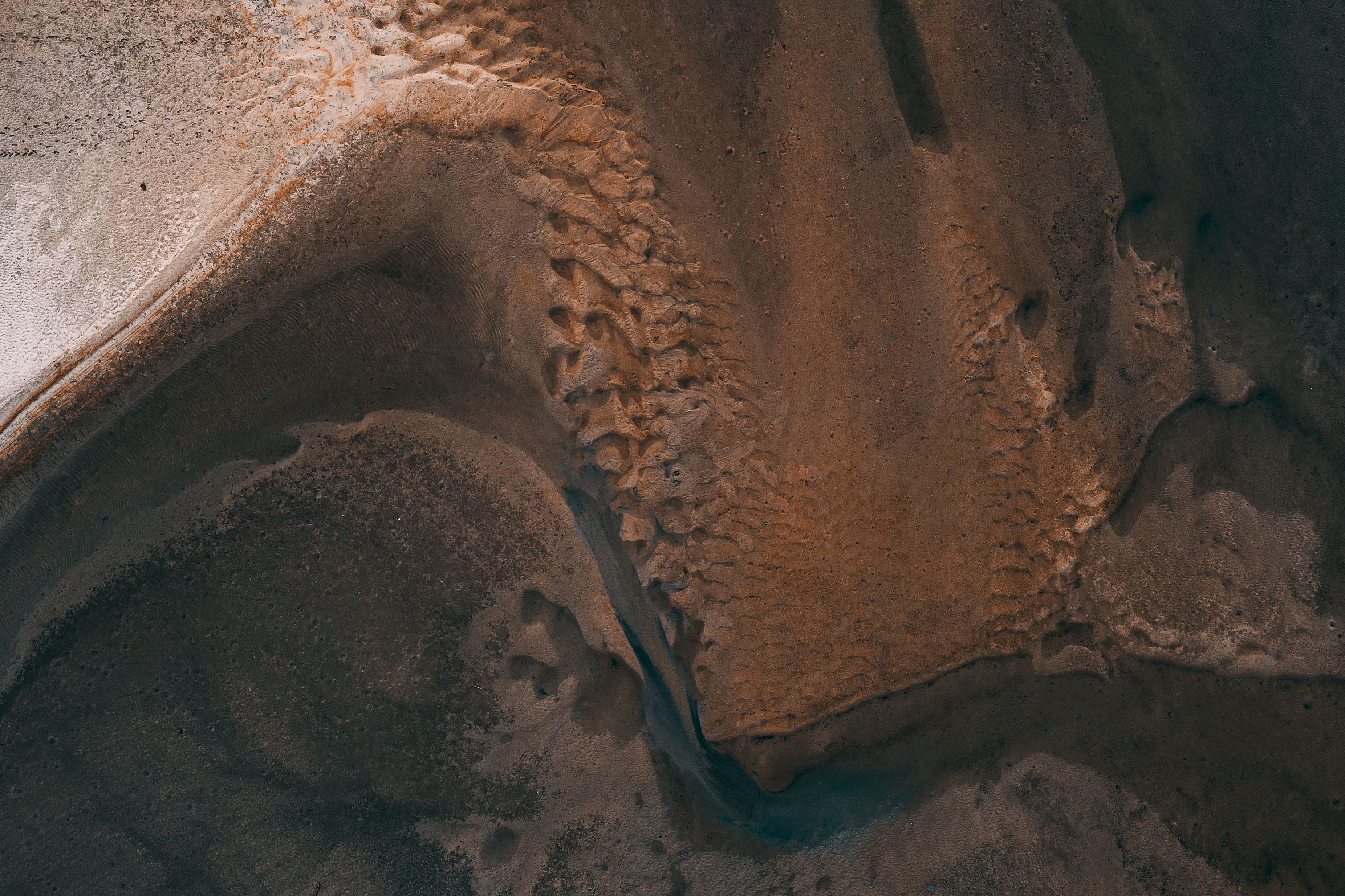 An aerial view of a cave with a river running through it · Free Stock Photo