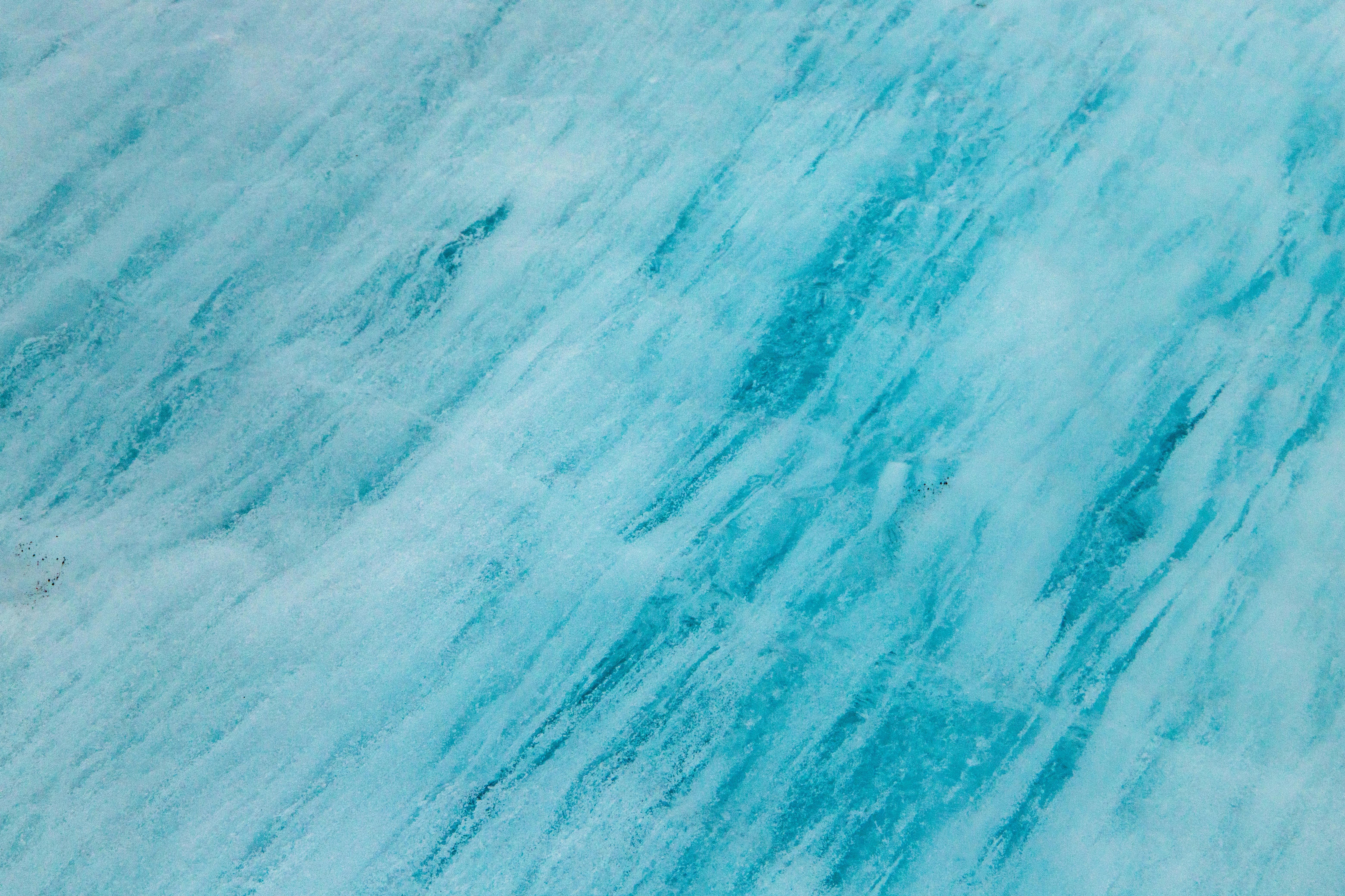 A close up of a blue ice surface · Free Stock Photo