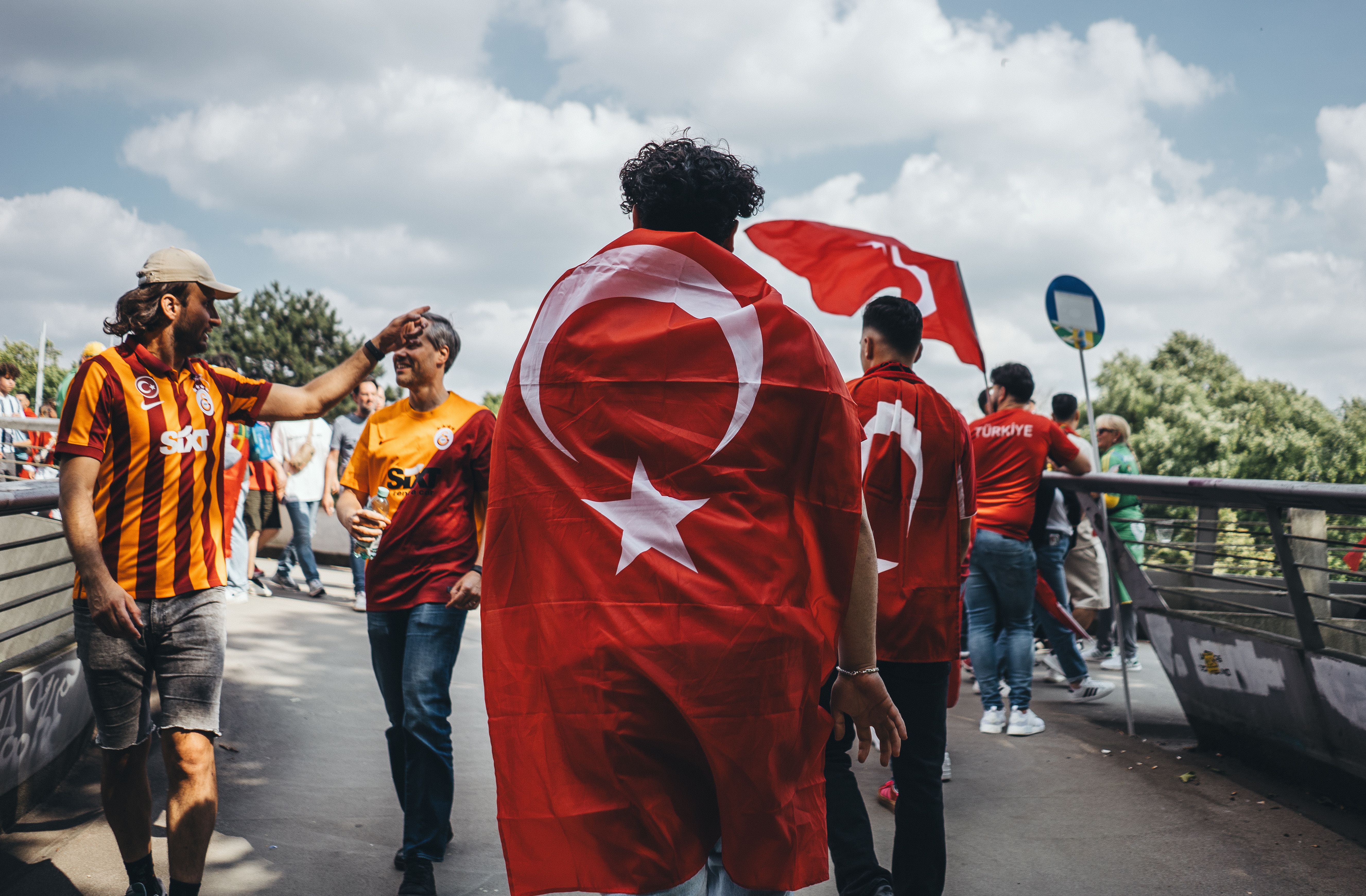 Sports Fans Wrapped in National Flags of Turkey · Free Stock Photo
