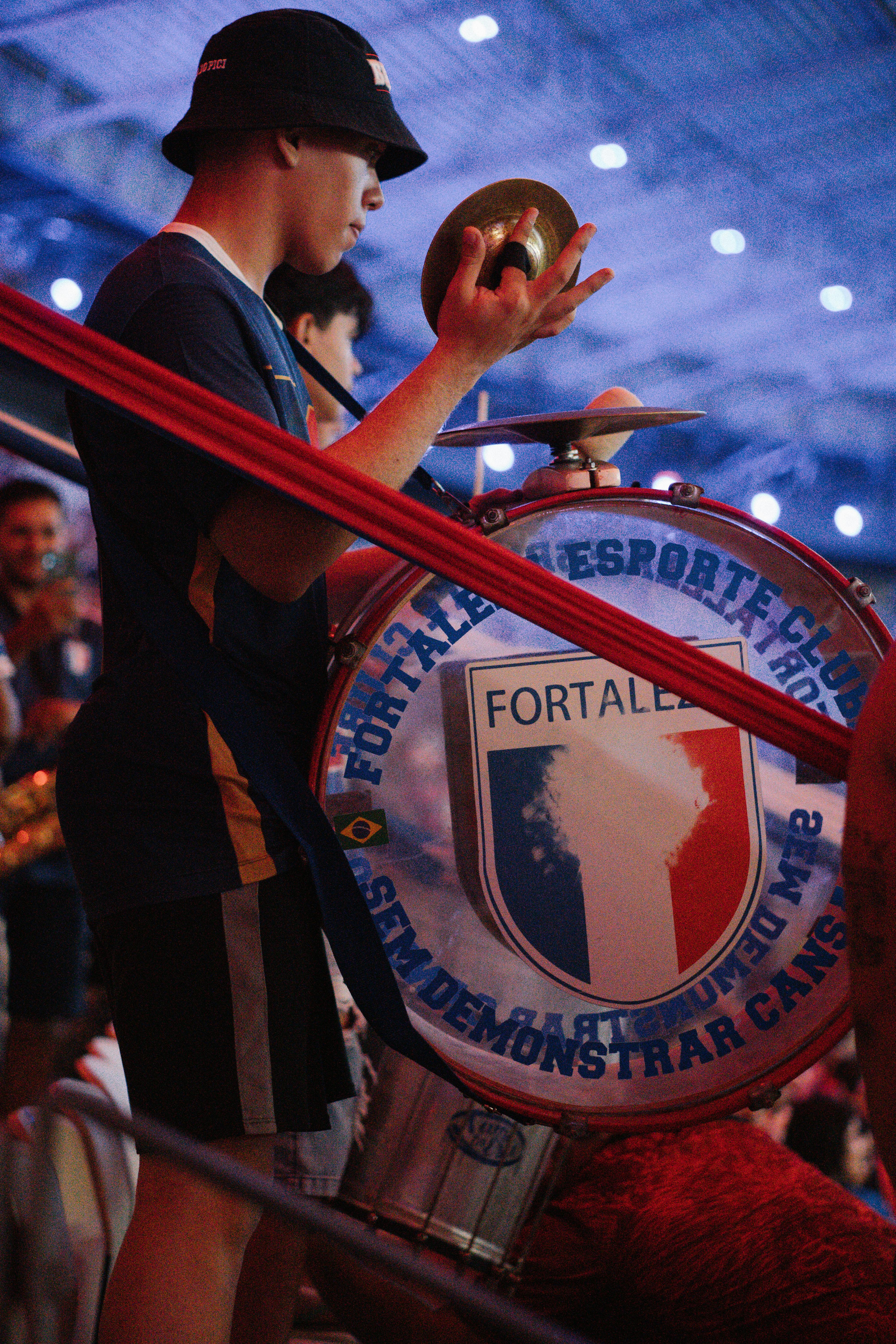 A boy playing the drums at a soccer game · Free Stock Photo