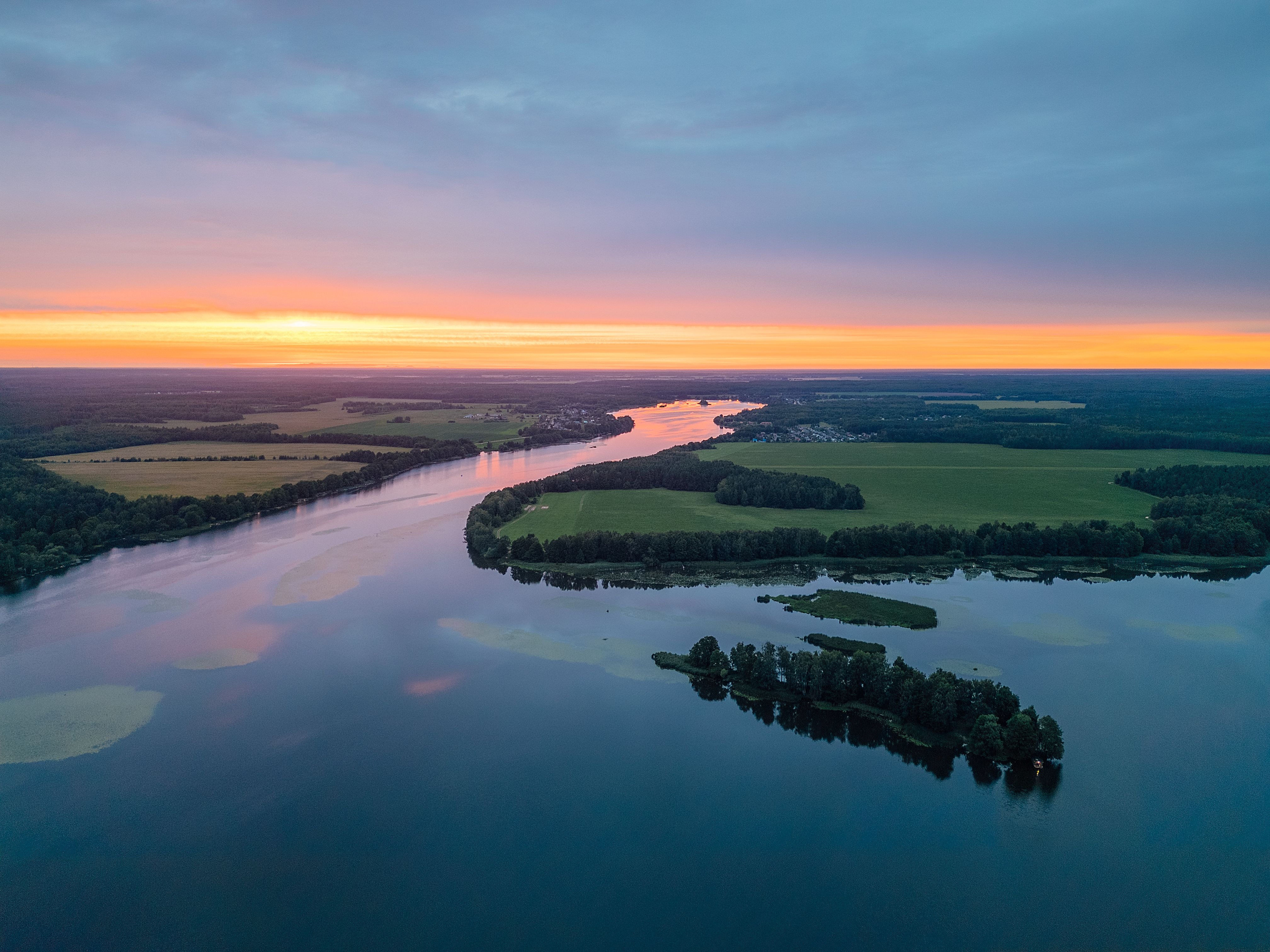Aerial view of the river and land in the middle of the sky · Free Stock ...