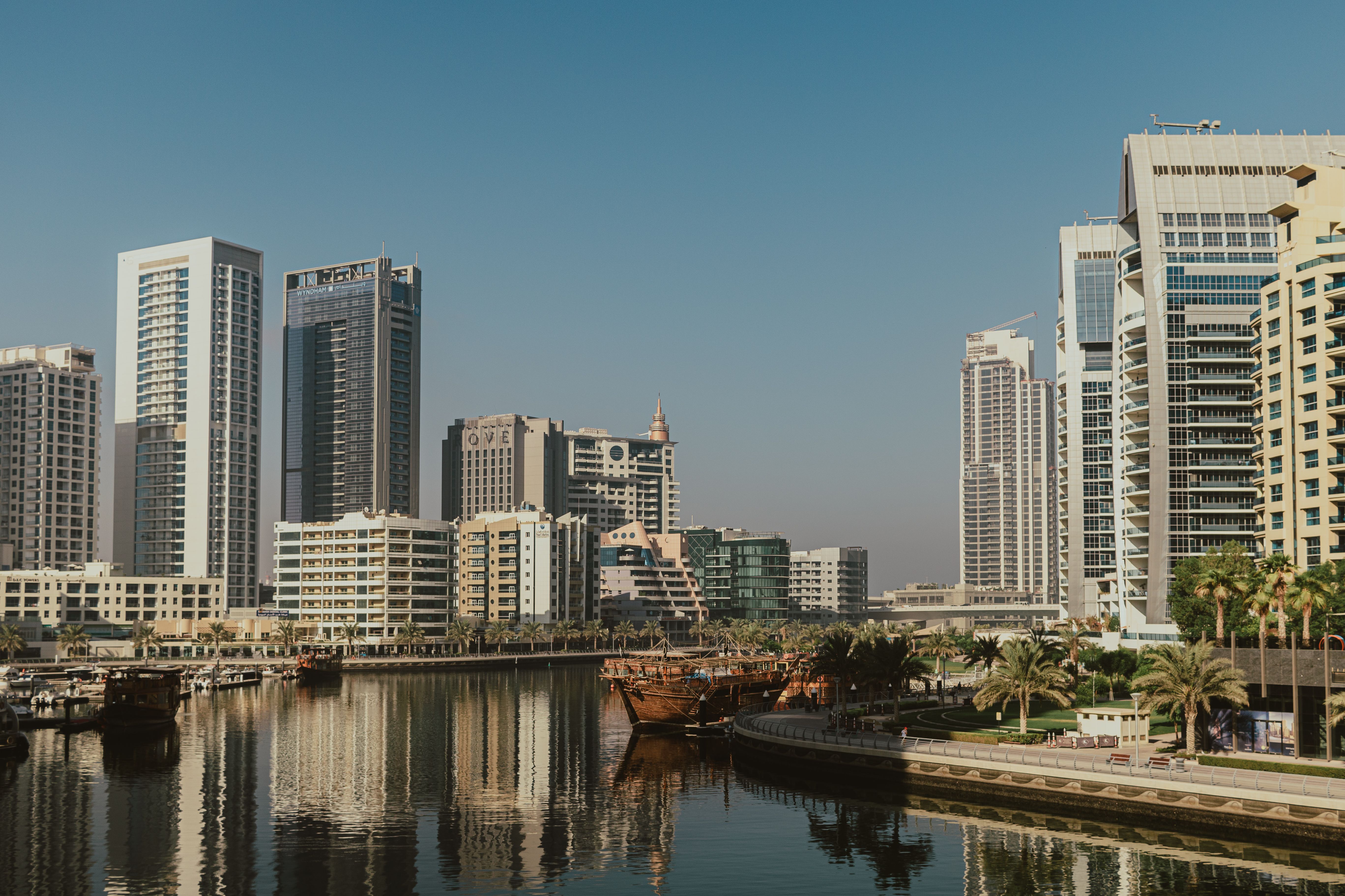Skyline with marina water view, high-rise buildings, and traditional ...