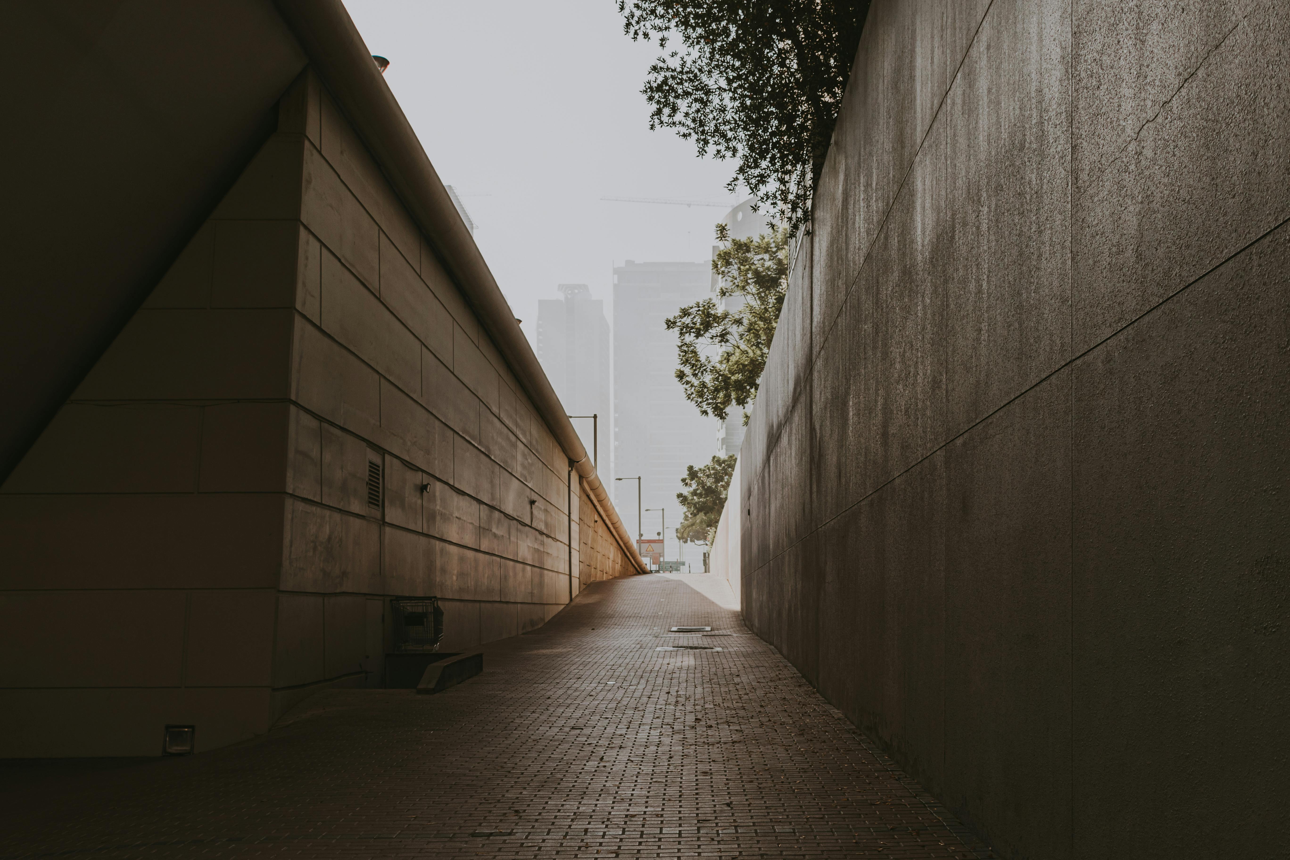 Pedestrian walkway with modern high-rise buildings on the background ...