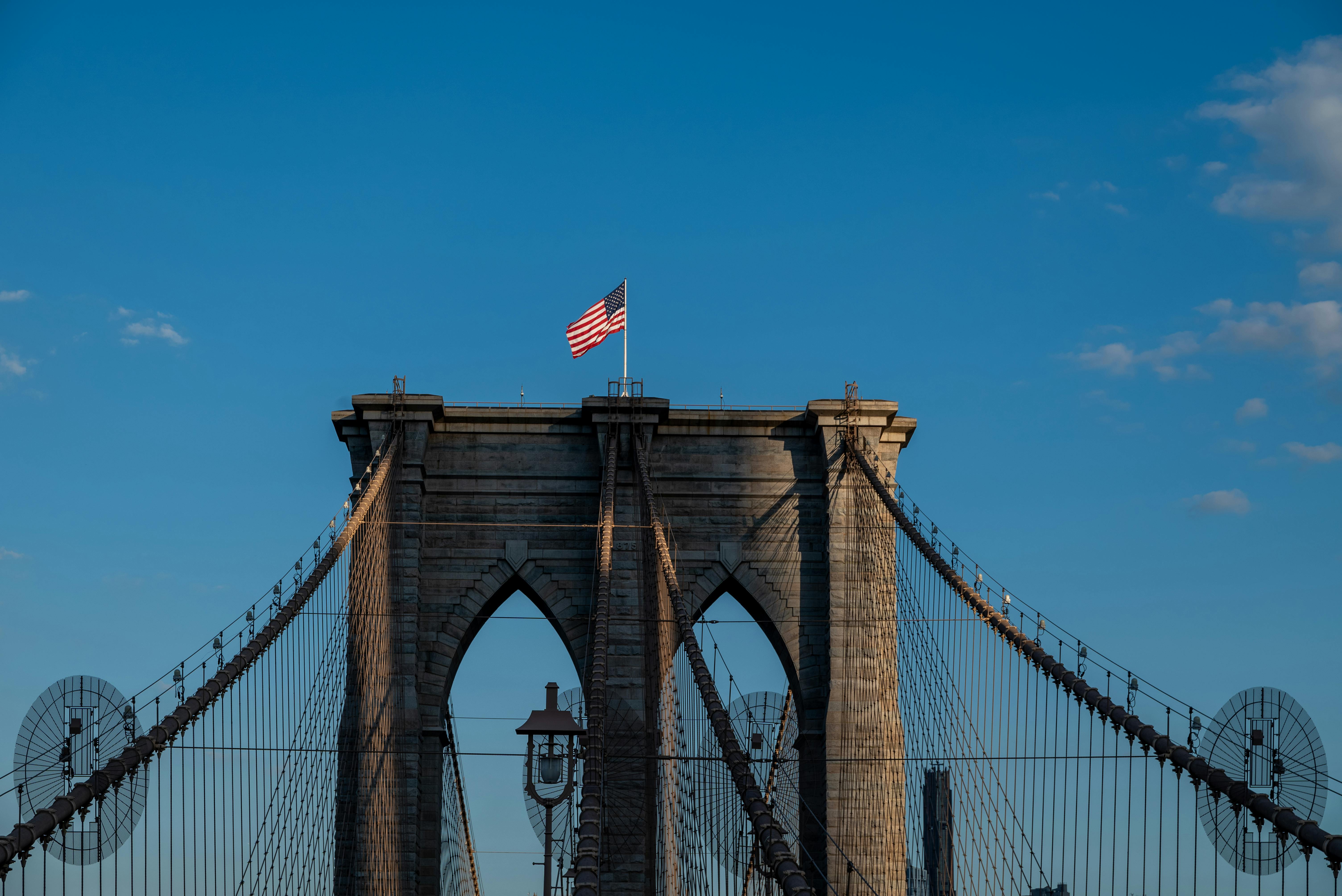 american flag on top of bridge · Free Stock Photo