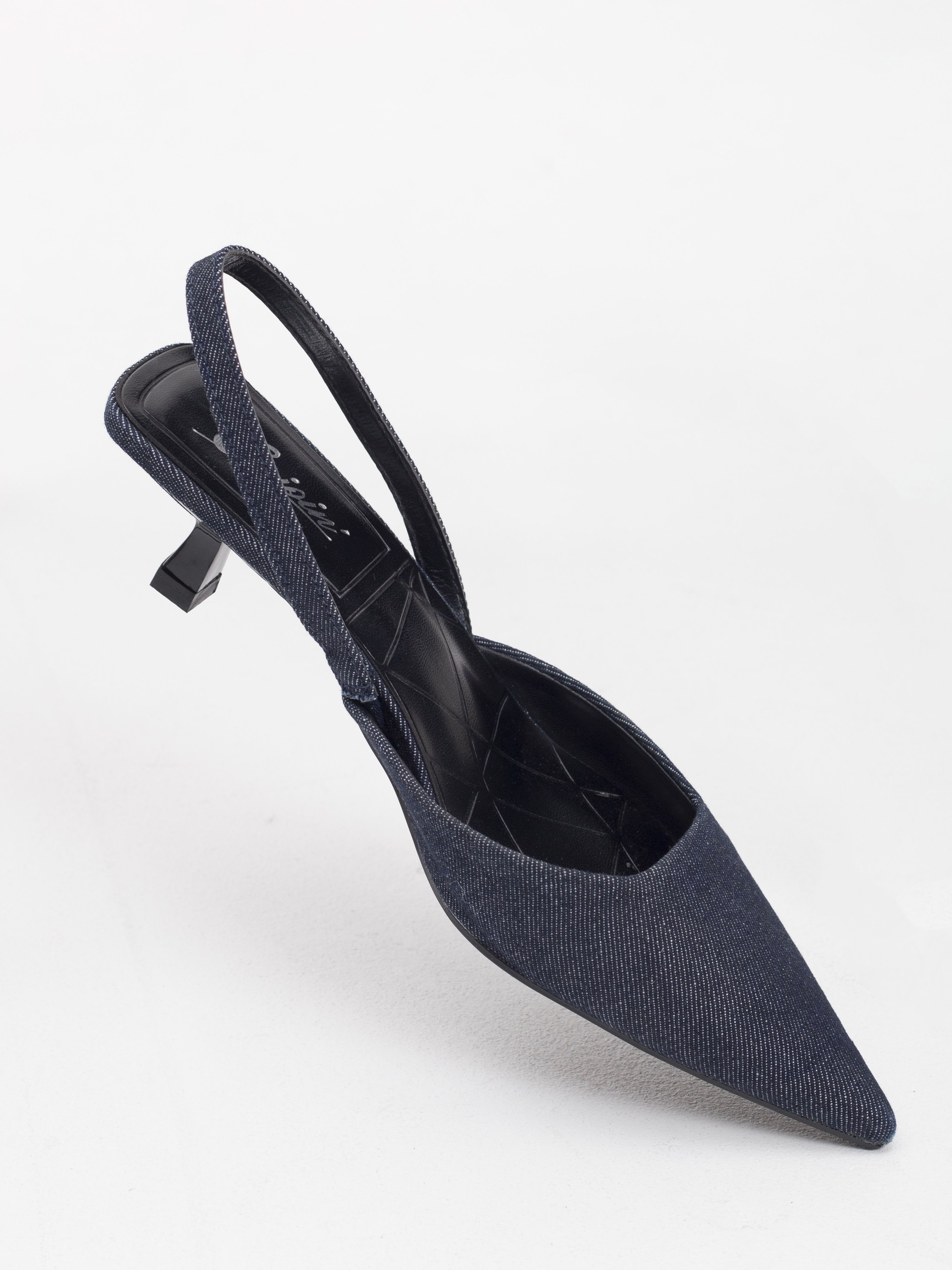 Stylish blue shoes in modern studio · Free Stock Photo
