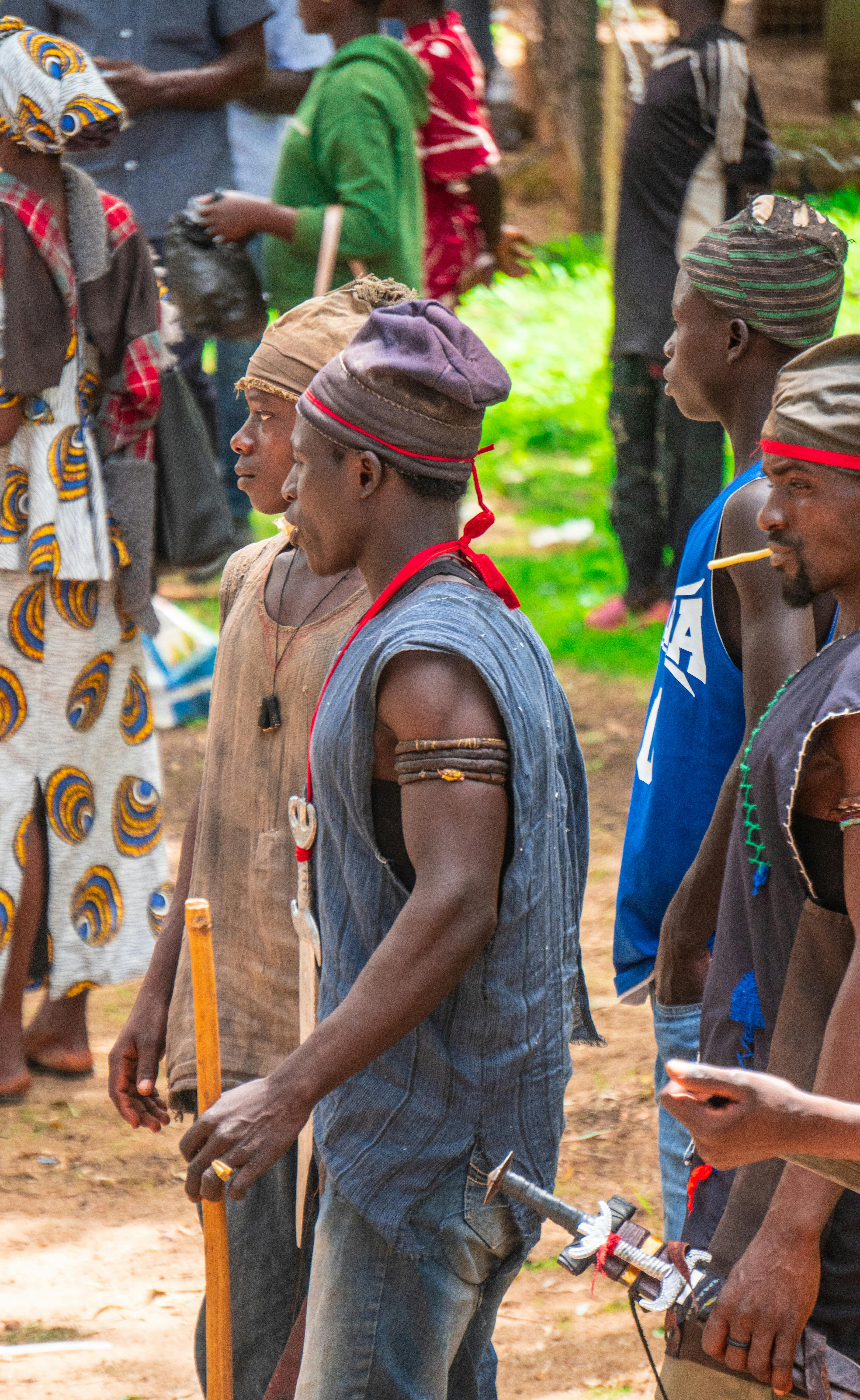 A group of people standing in a field · Free Stock Photo