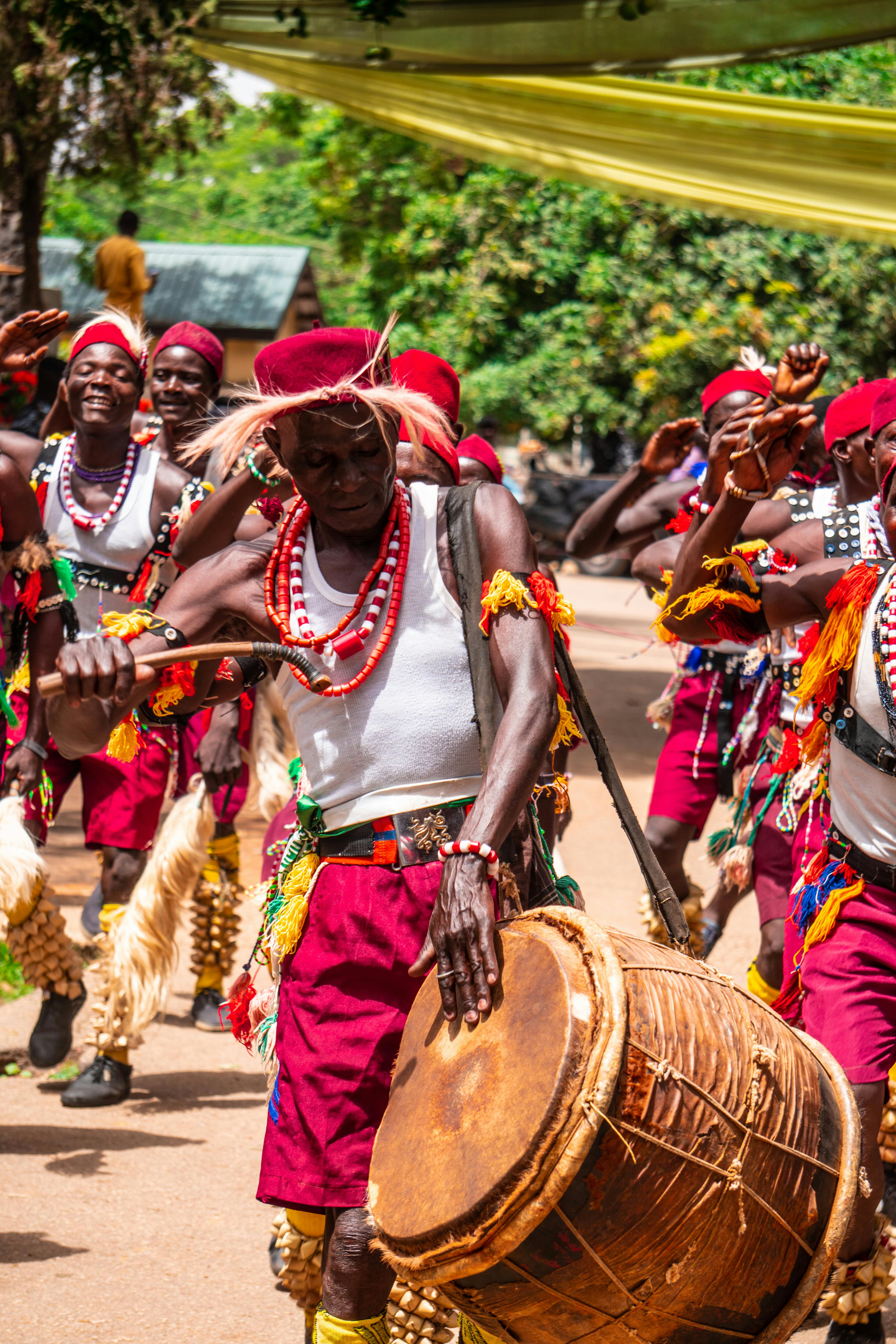 A group of men in african clothing playing drums · Free Stock Photo