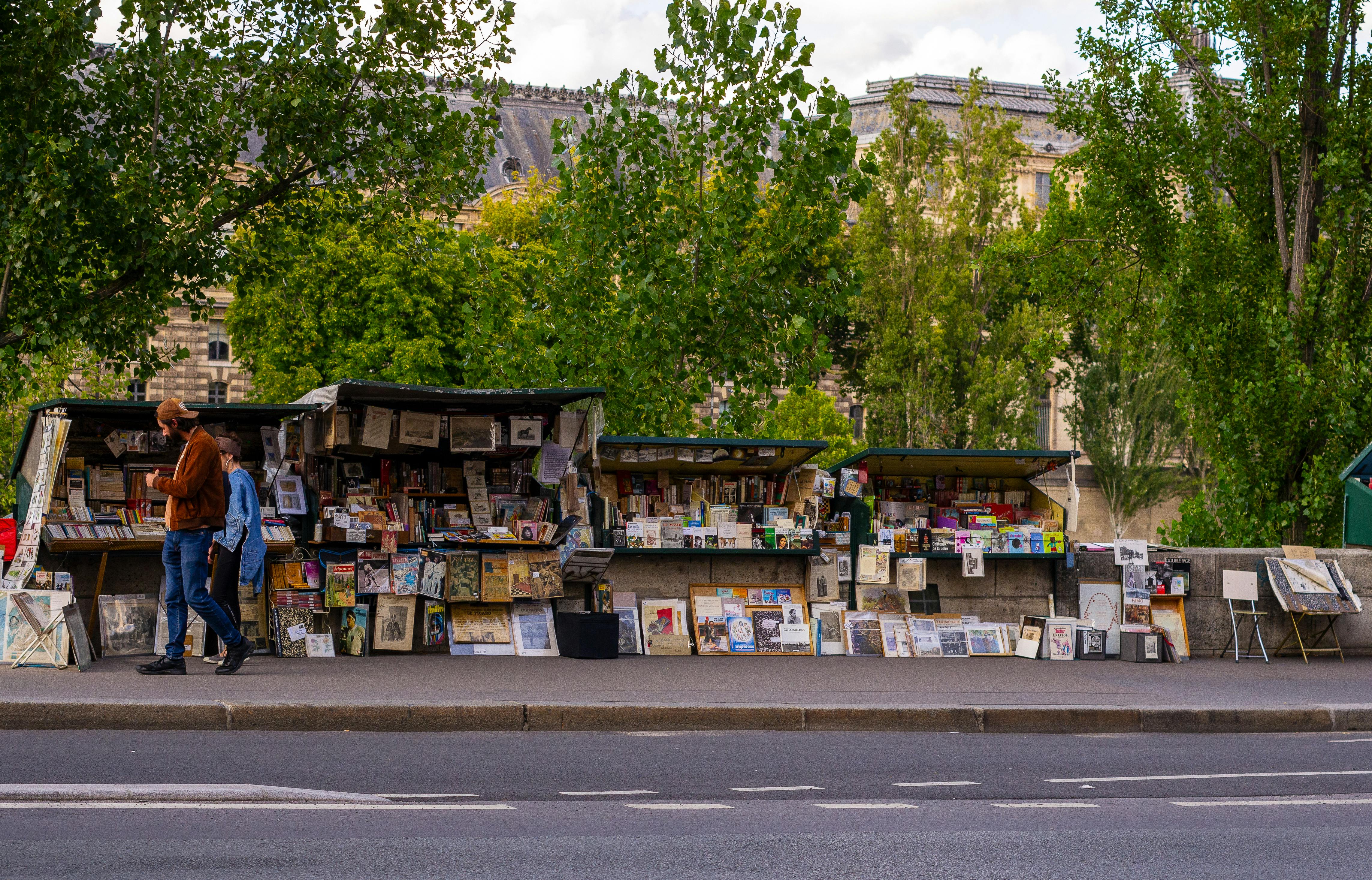 Book Stalls Along Sidewalk in Town · Free Stock Photo