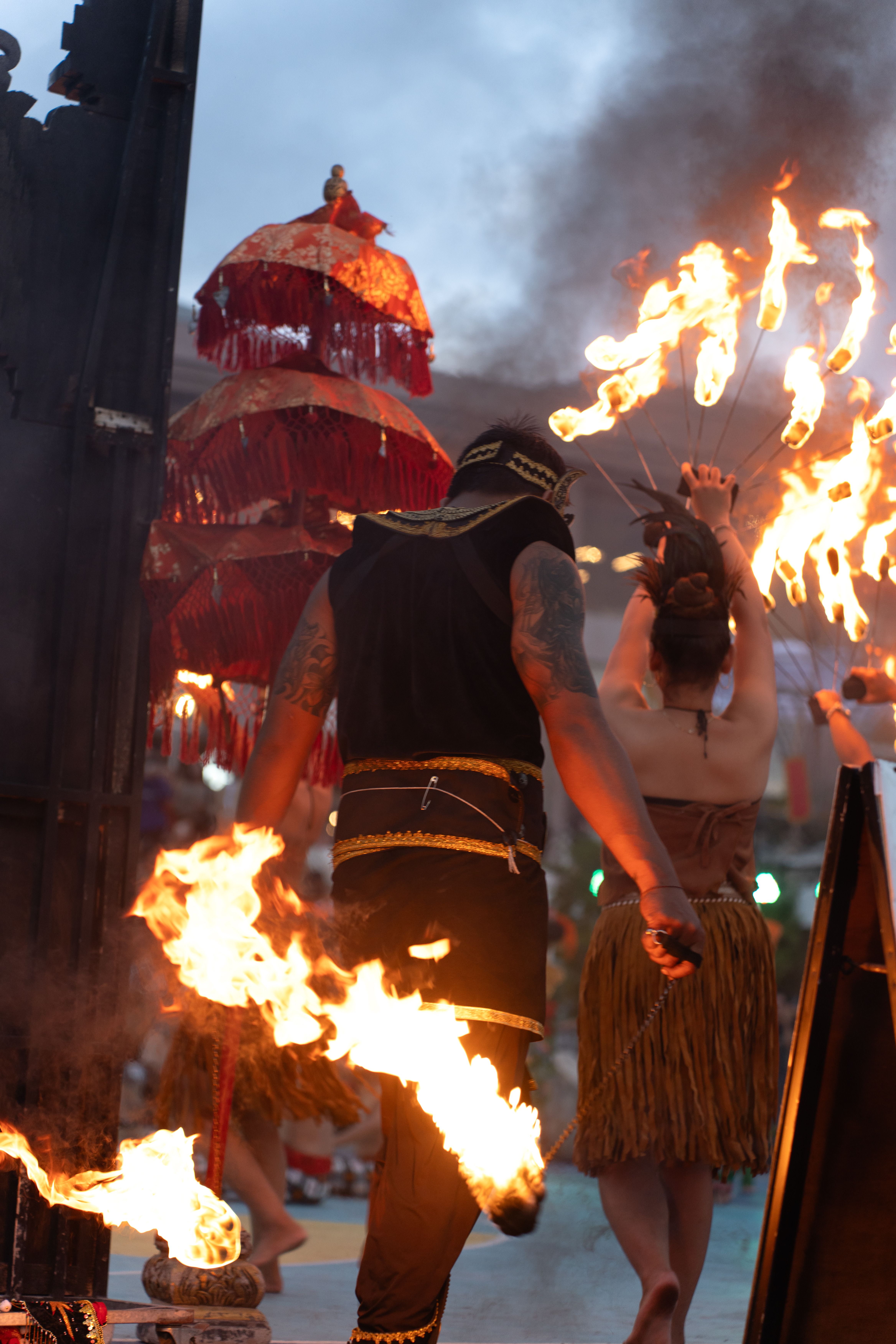 A man in a costume with fire on his head · Free Stock Photo