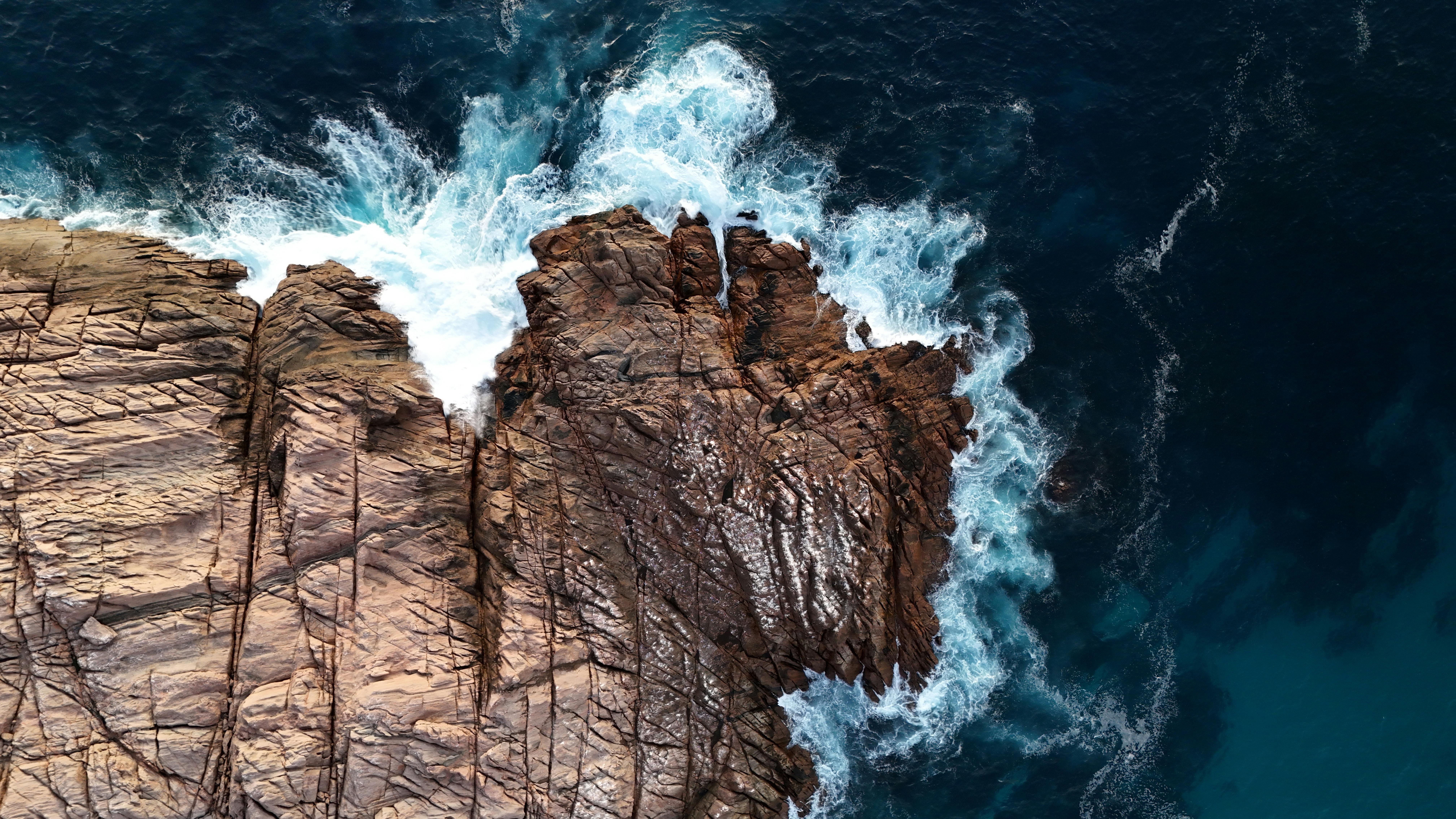 Aerial view of the ocean and rocks · Free Stock Photo