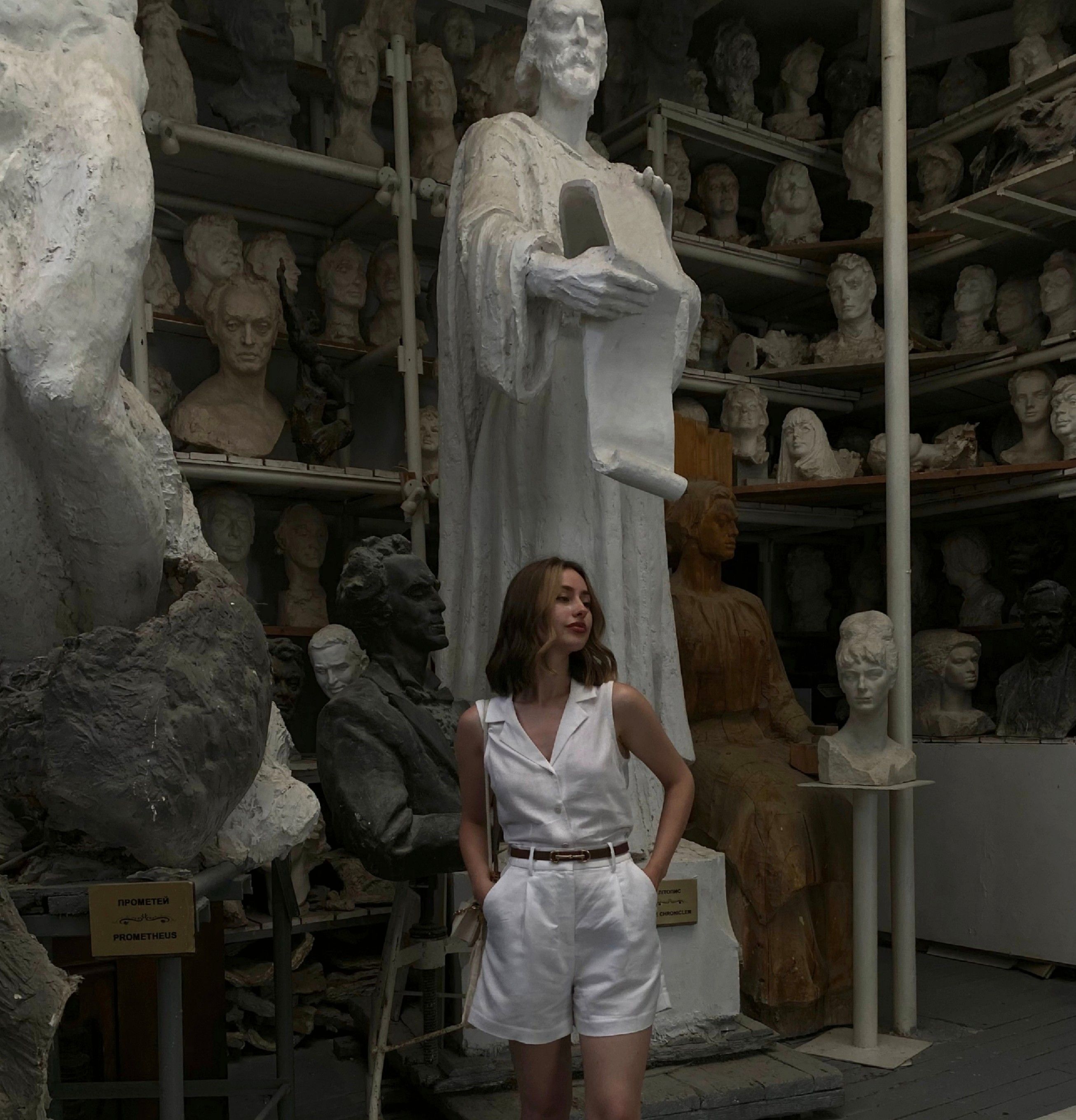 An Elegant Woman Standing among Statues · Free Stock Photo