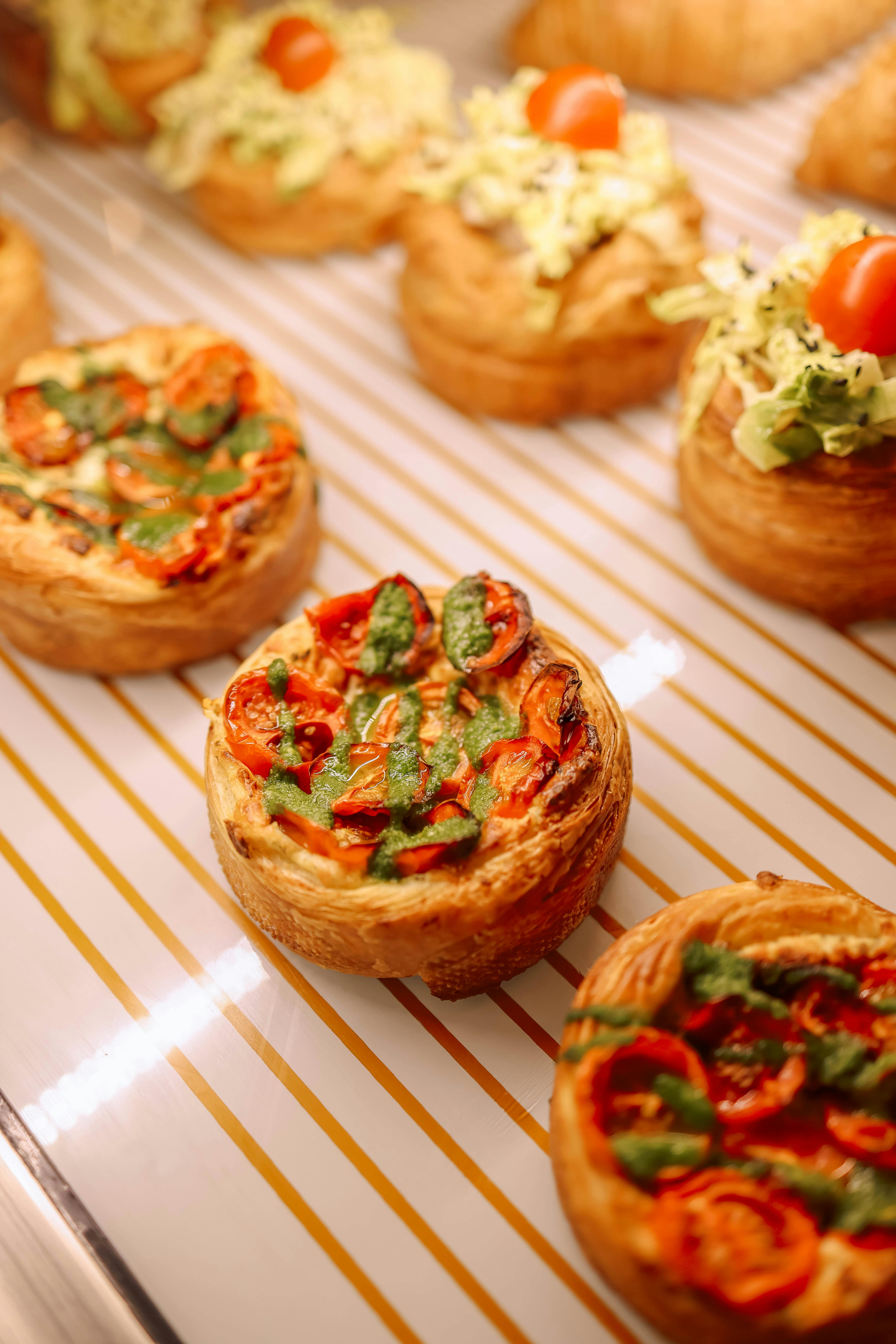 A display of small pastries with toppings · Free Stock Photo