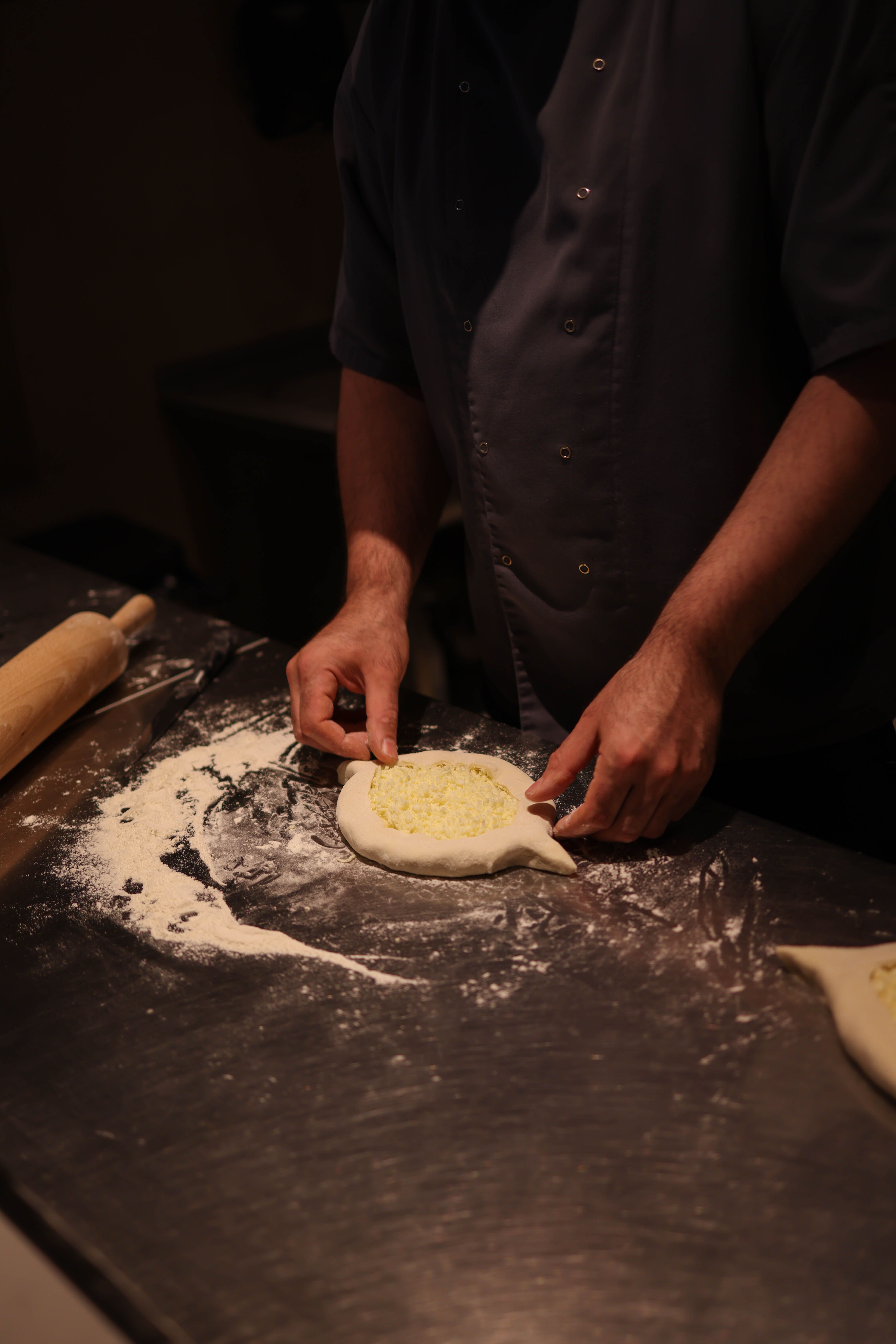 Cook Preparing Mini Pide · Free Stock Photo