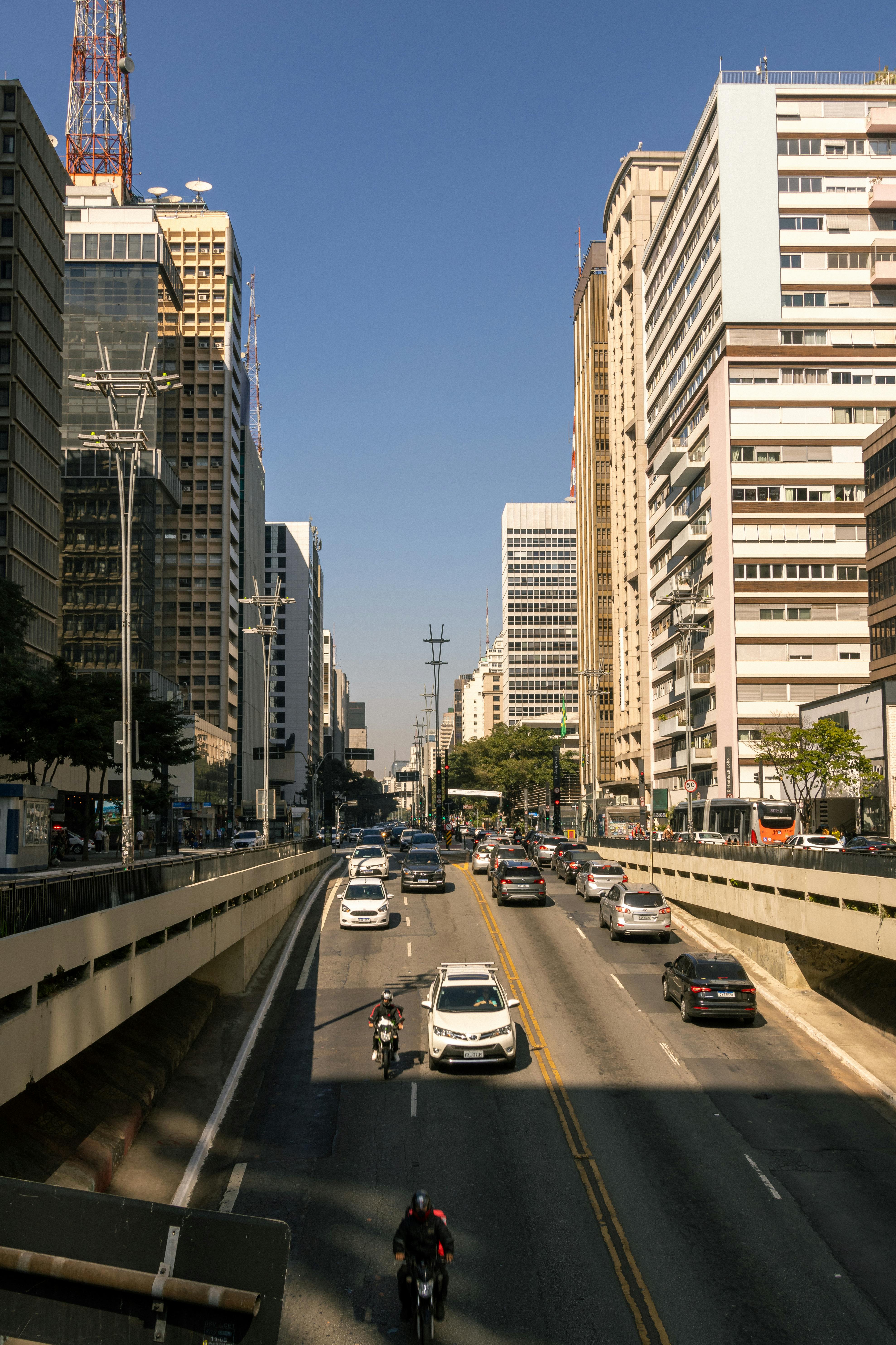 Photo of Man Sitting in Middle of Road · Free Stock Photo
