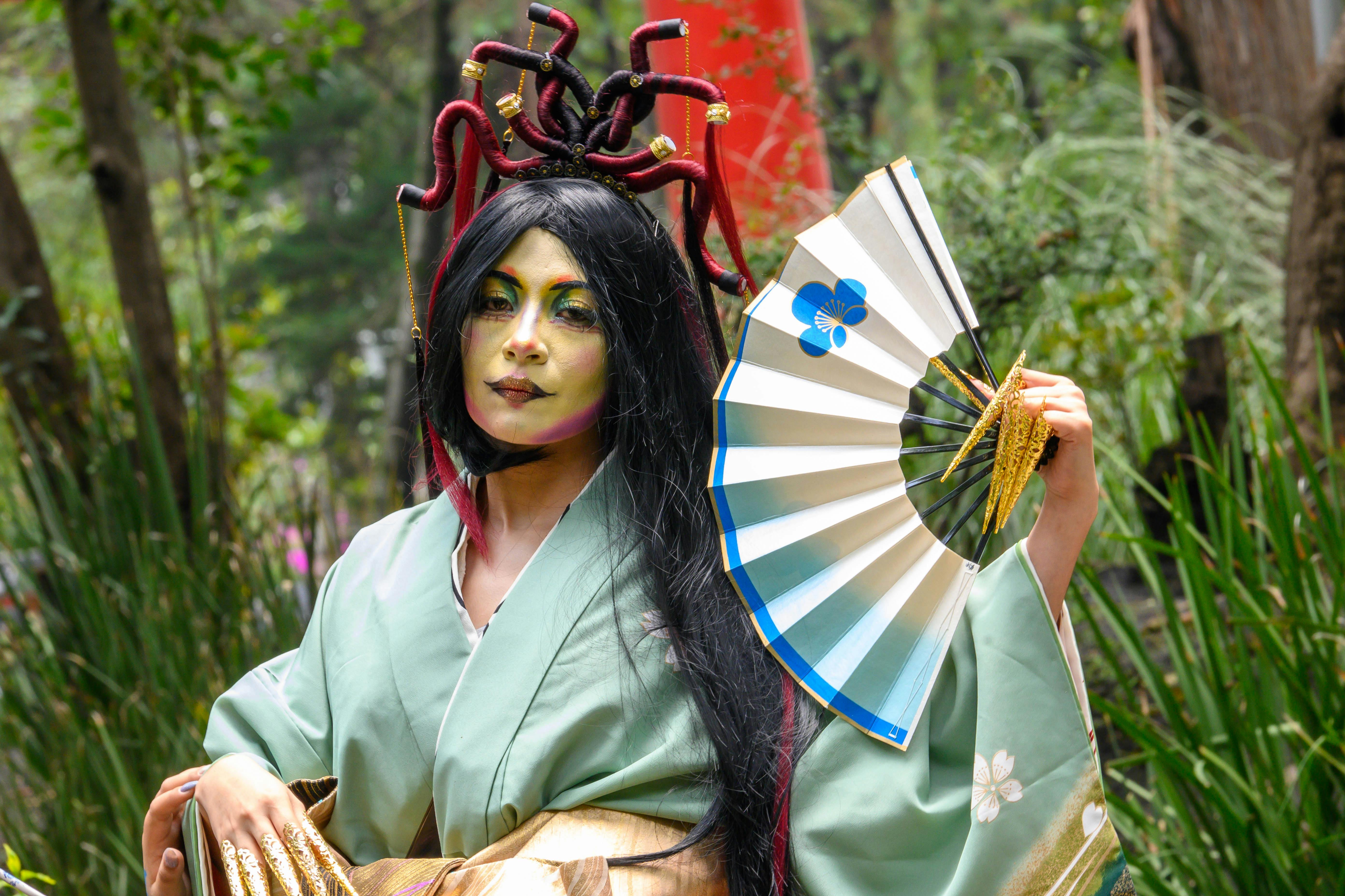 Woman Wearing Kimono Holding Fan · Free Stock Photo