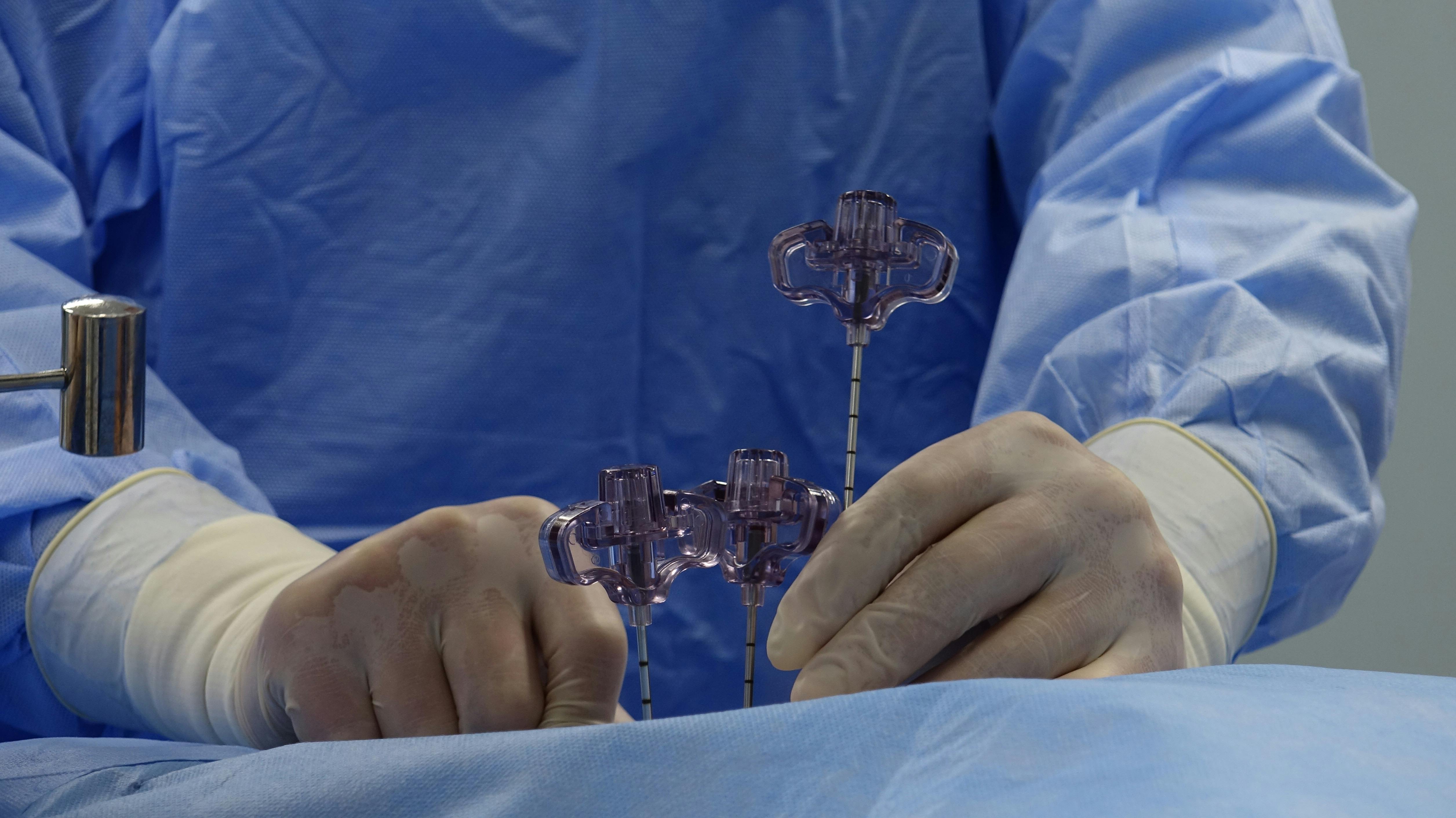 Hands of a Surgeon Using Bone Puncture Needles · Free Stock Photo