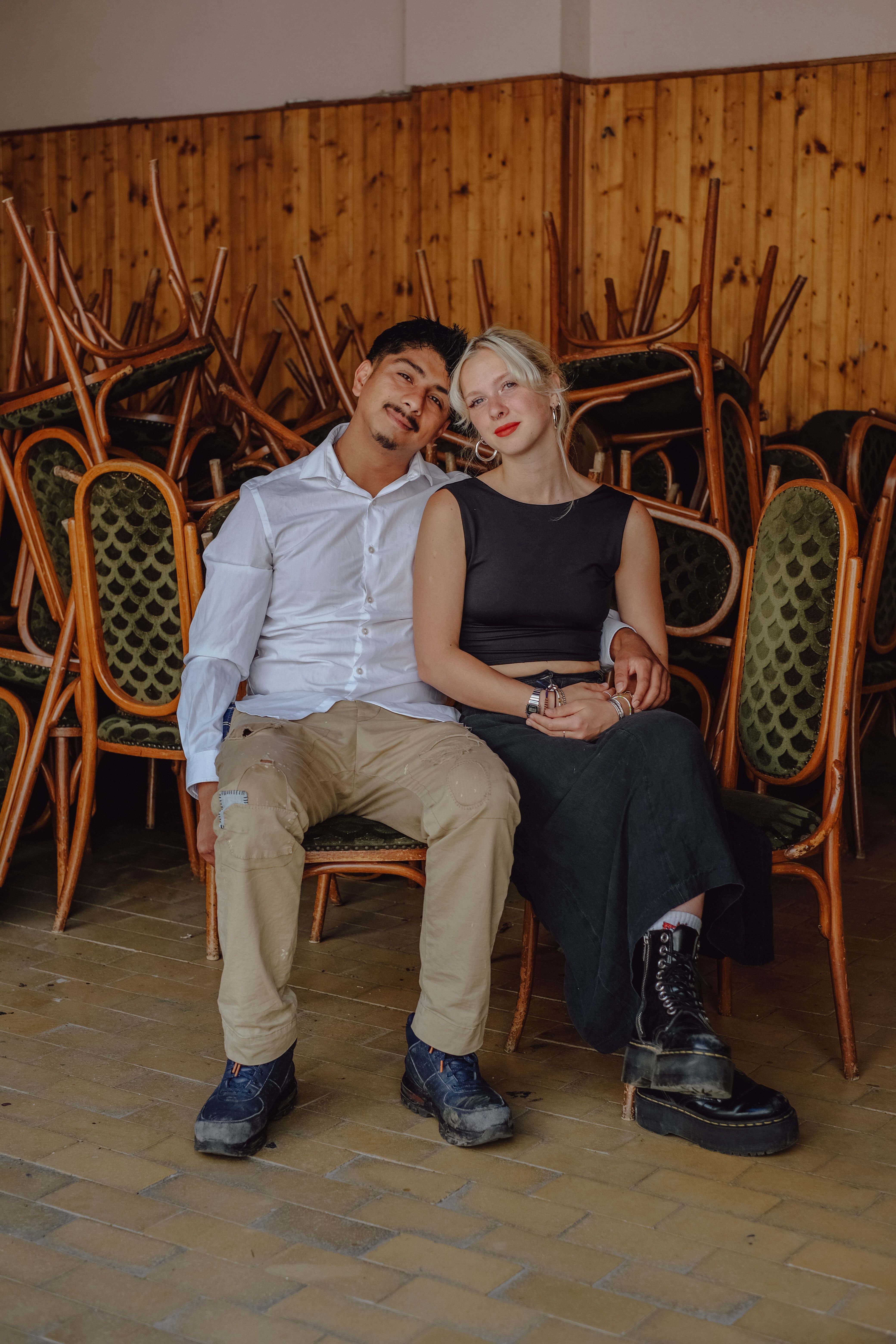 A couple sitting on chairs in a room · Free Stock Photo
