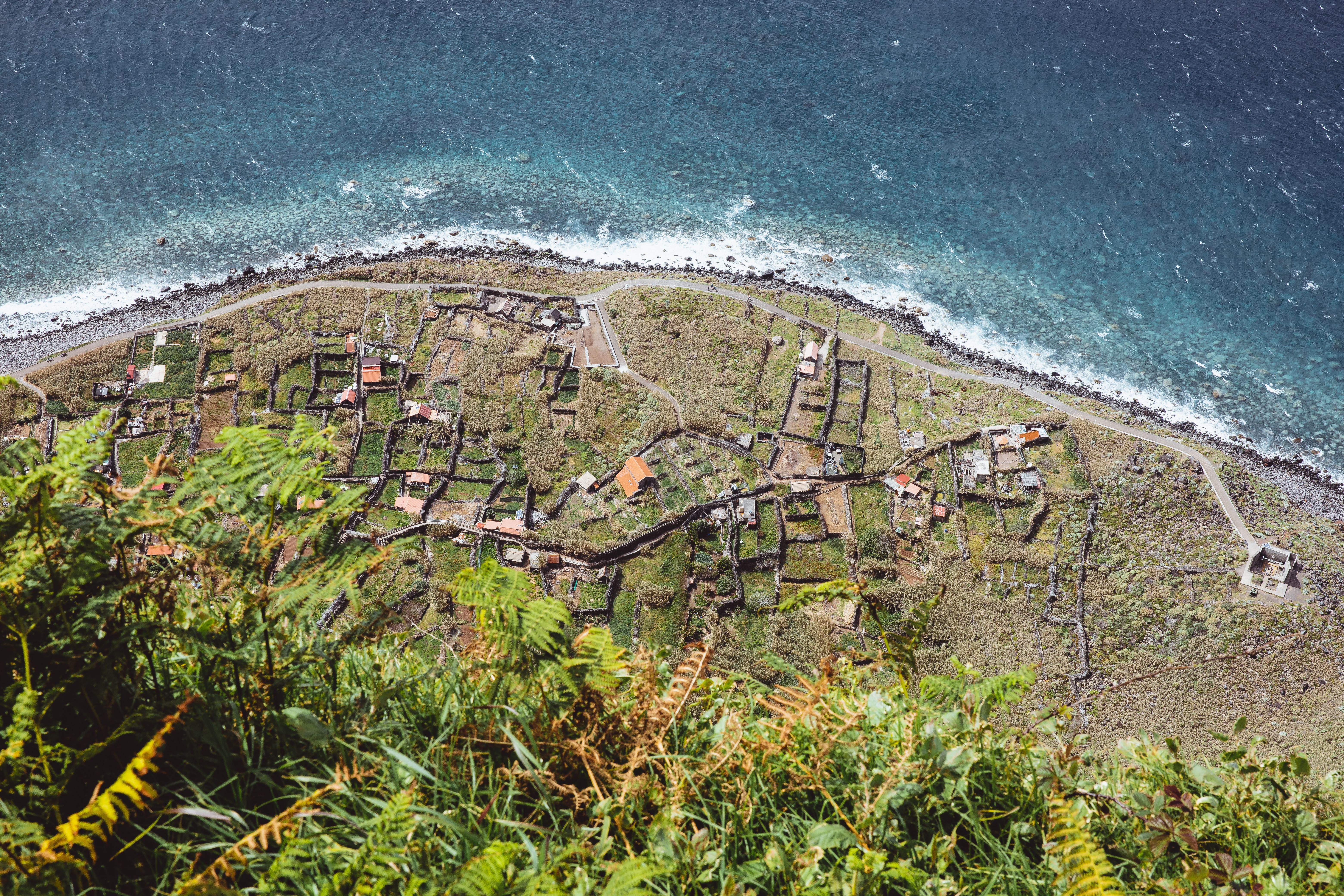A view of a beach and a small village · Free Stock Photo