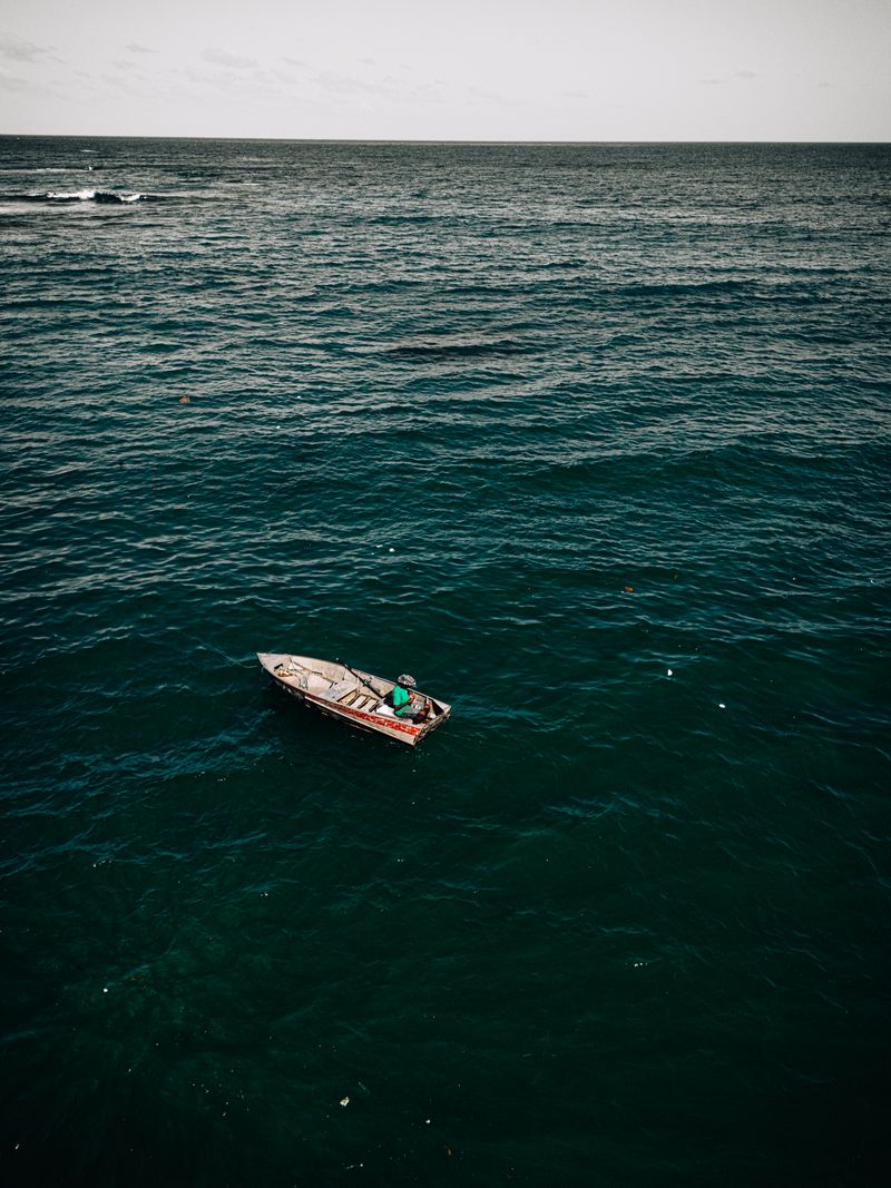 Small Boat In The Ocean Photos, Download The BEST Free Small Boat In ...