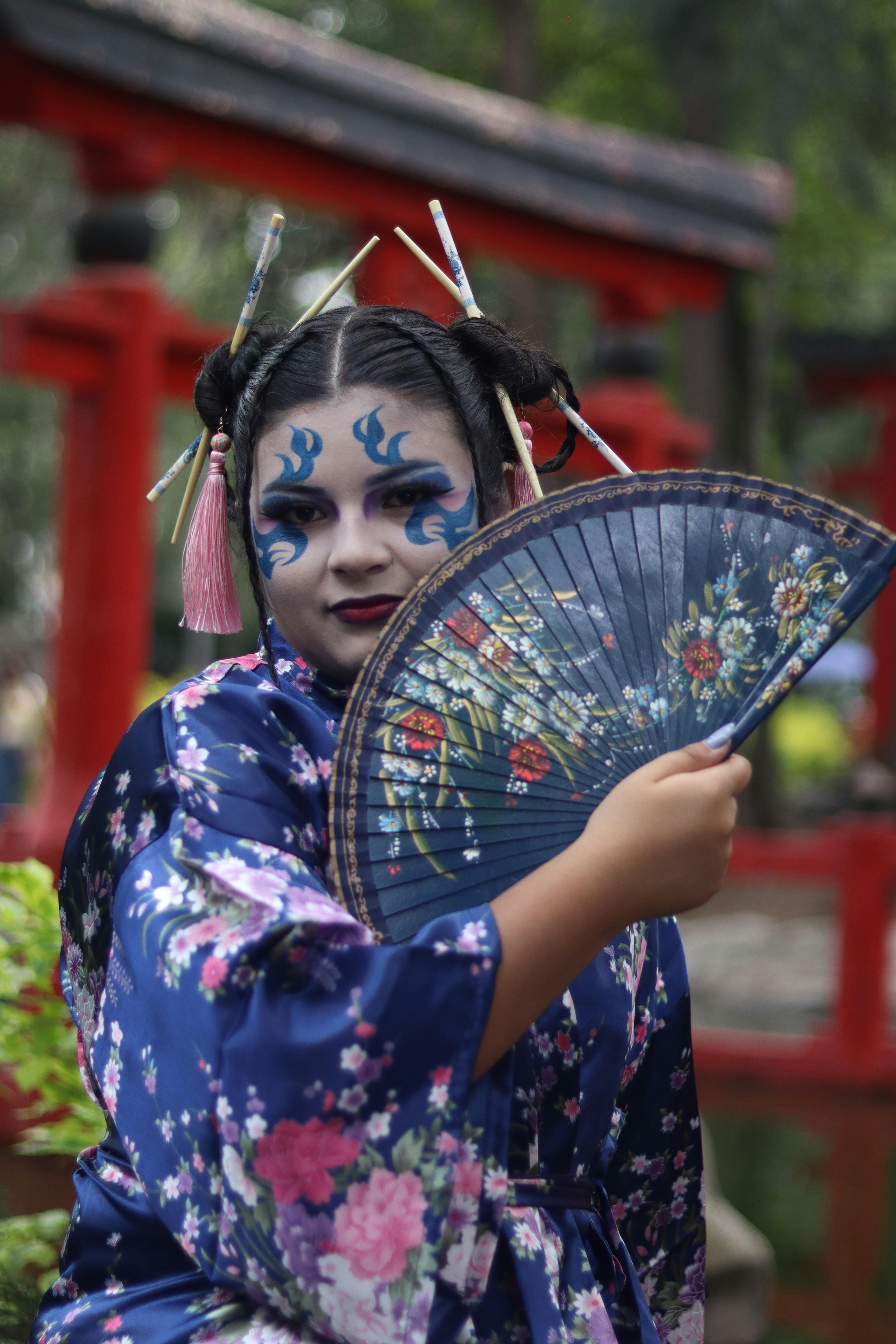 Japanese Woman Holding Brown Hand Fan · Free Stock Photo