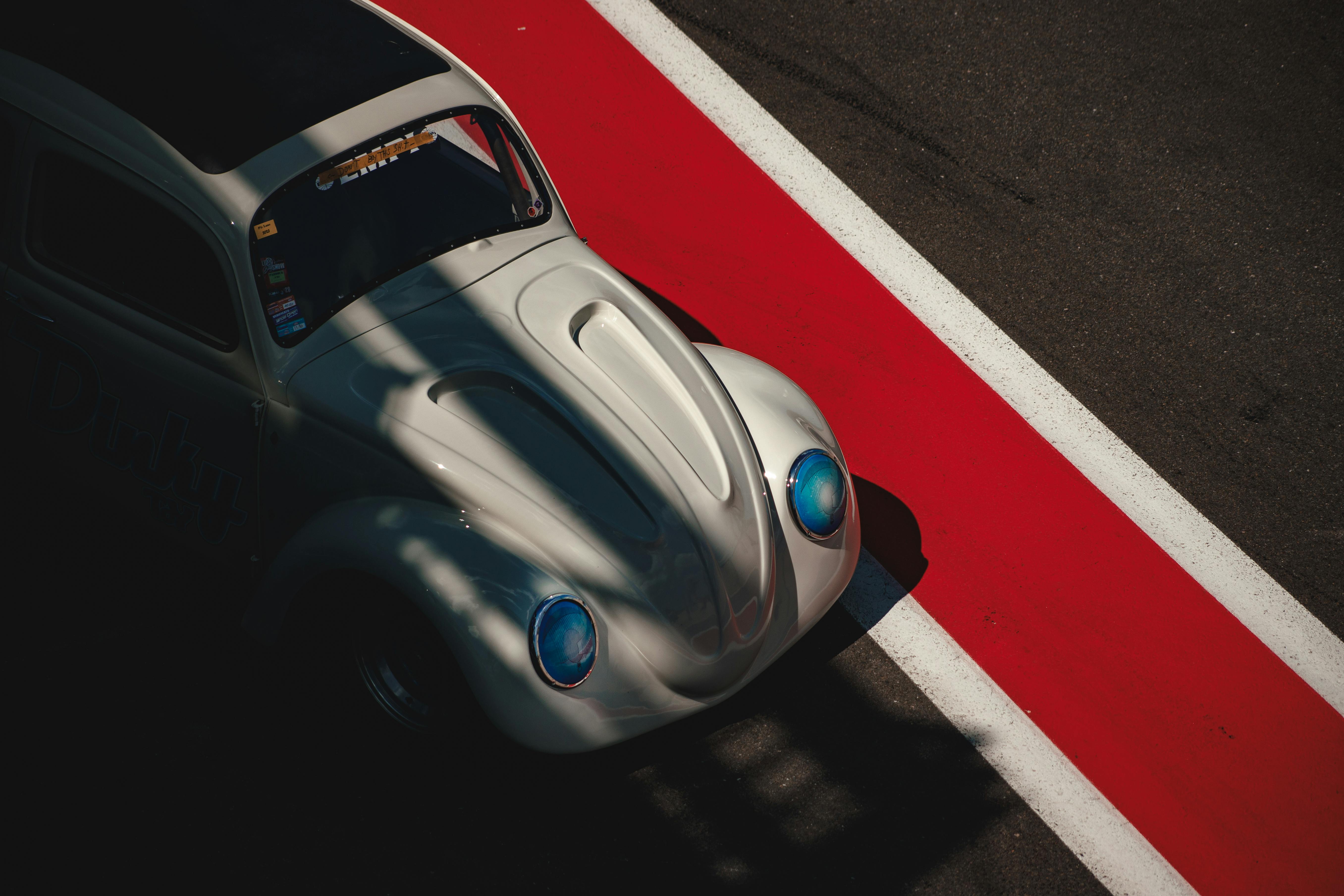 View of a Vintage Volkswagen Beetle Parked on the Street · Free Stock Photo