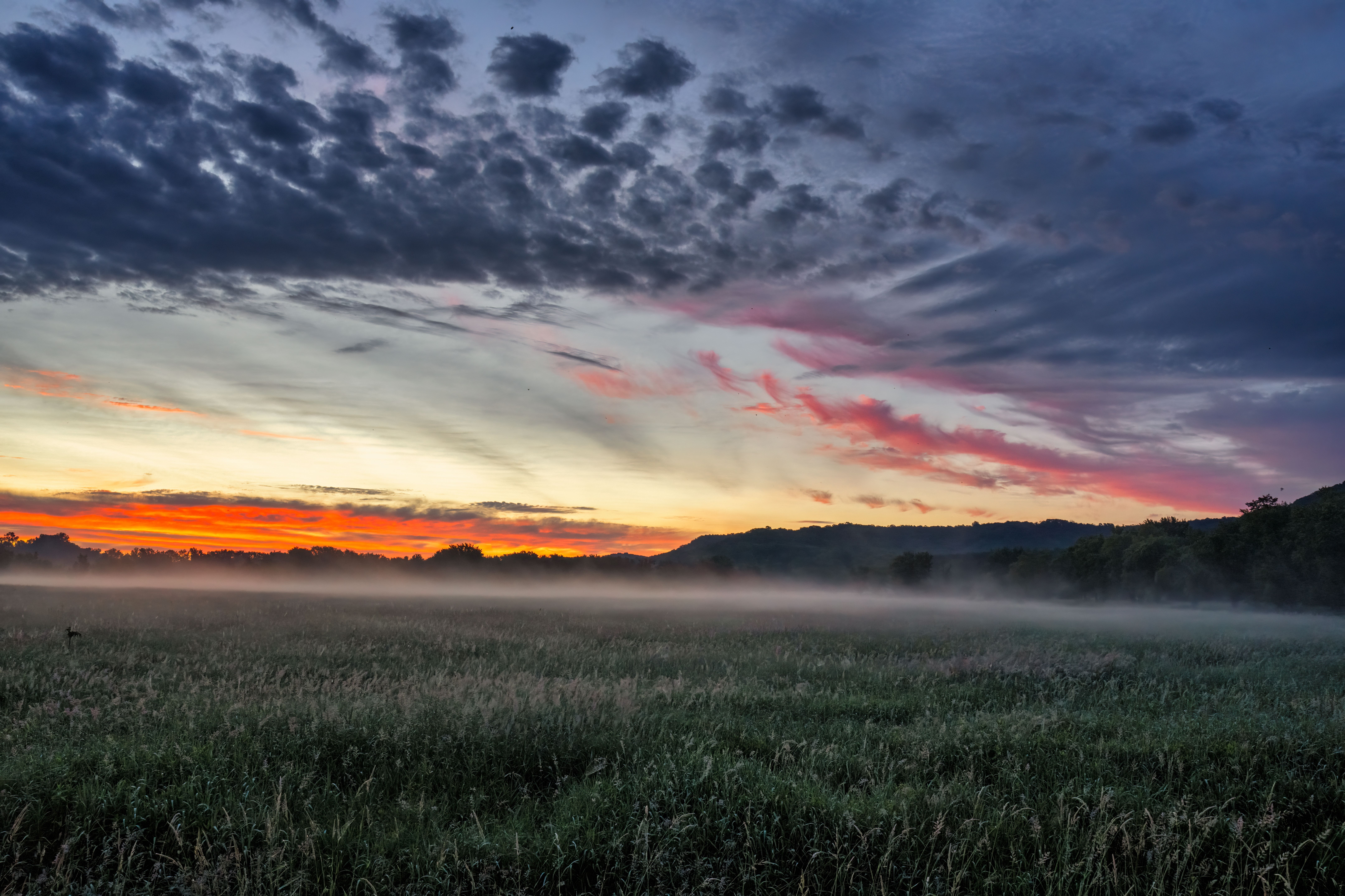 Storm Clouds over Field During Sunset · Free Stock Photo