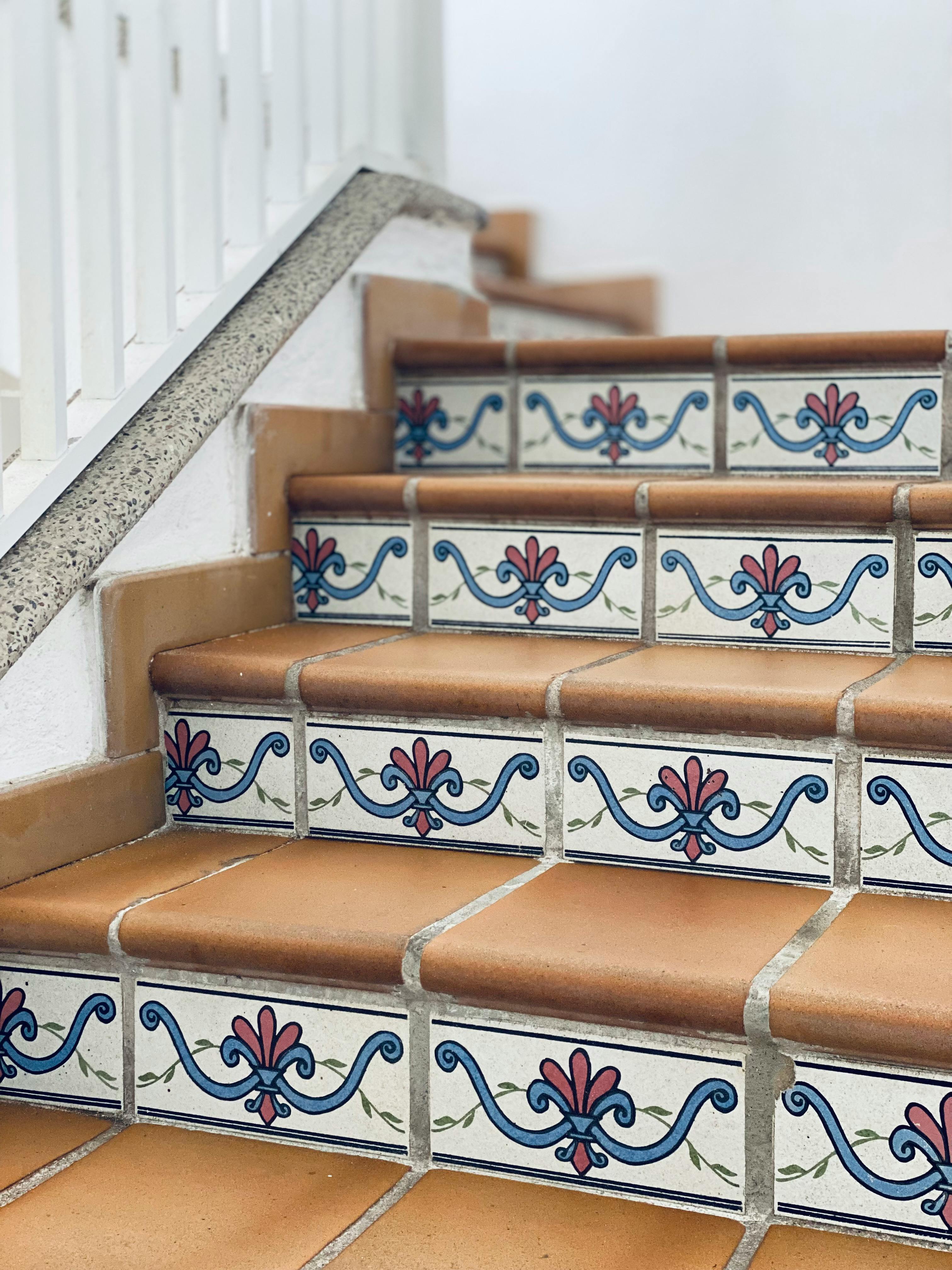 A set of stairs with decorative tiles on them · Free Stock Photo