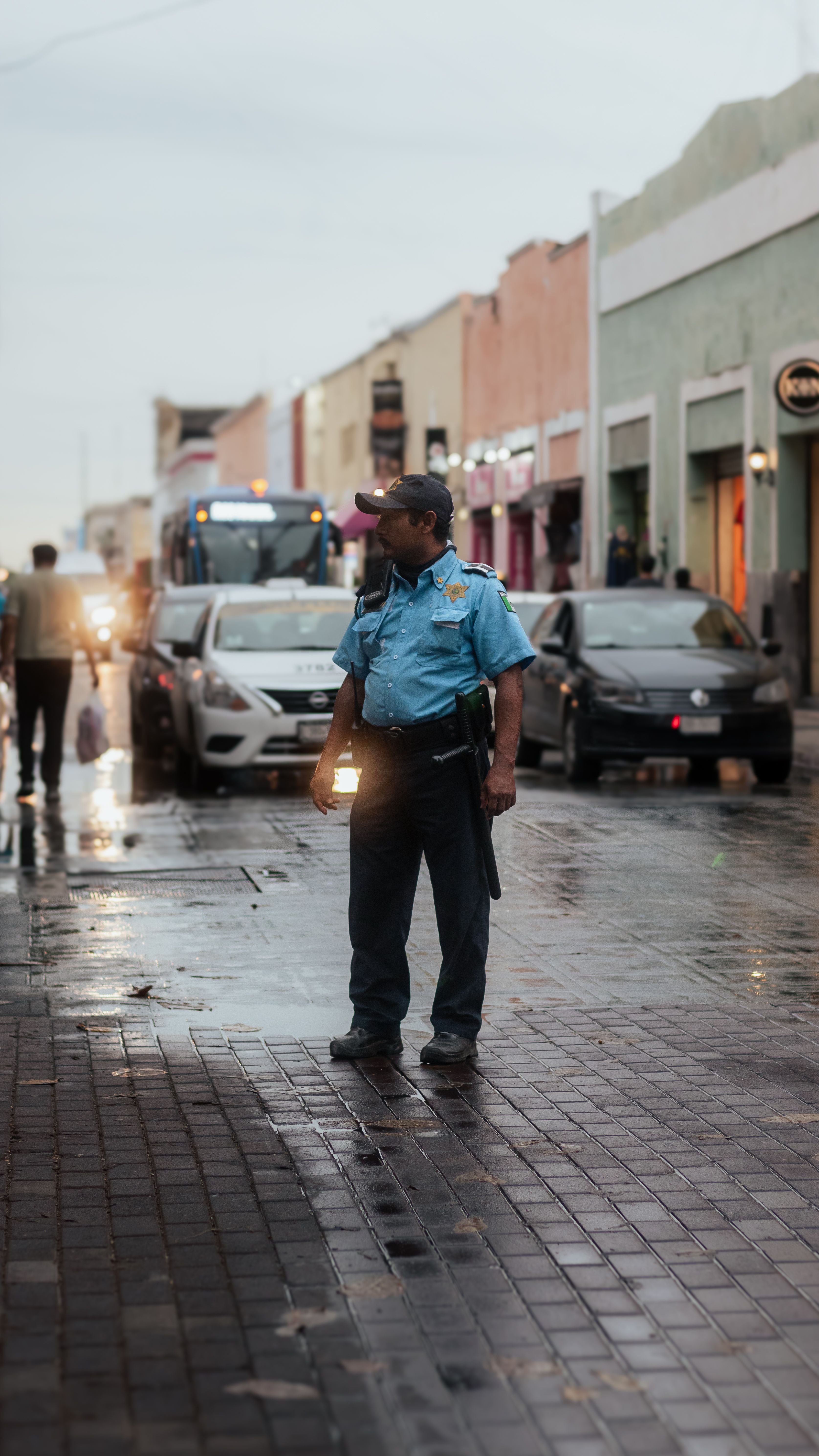 Policeman Standing in front of Incoming Cars · Free Stock Photo