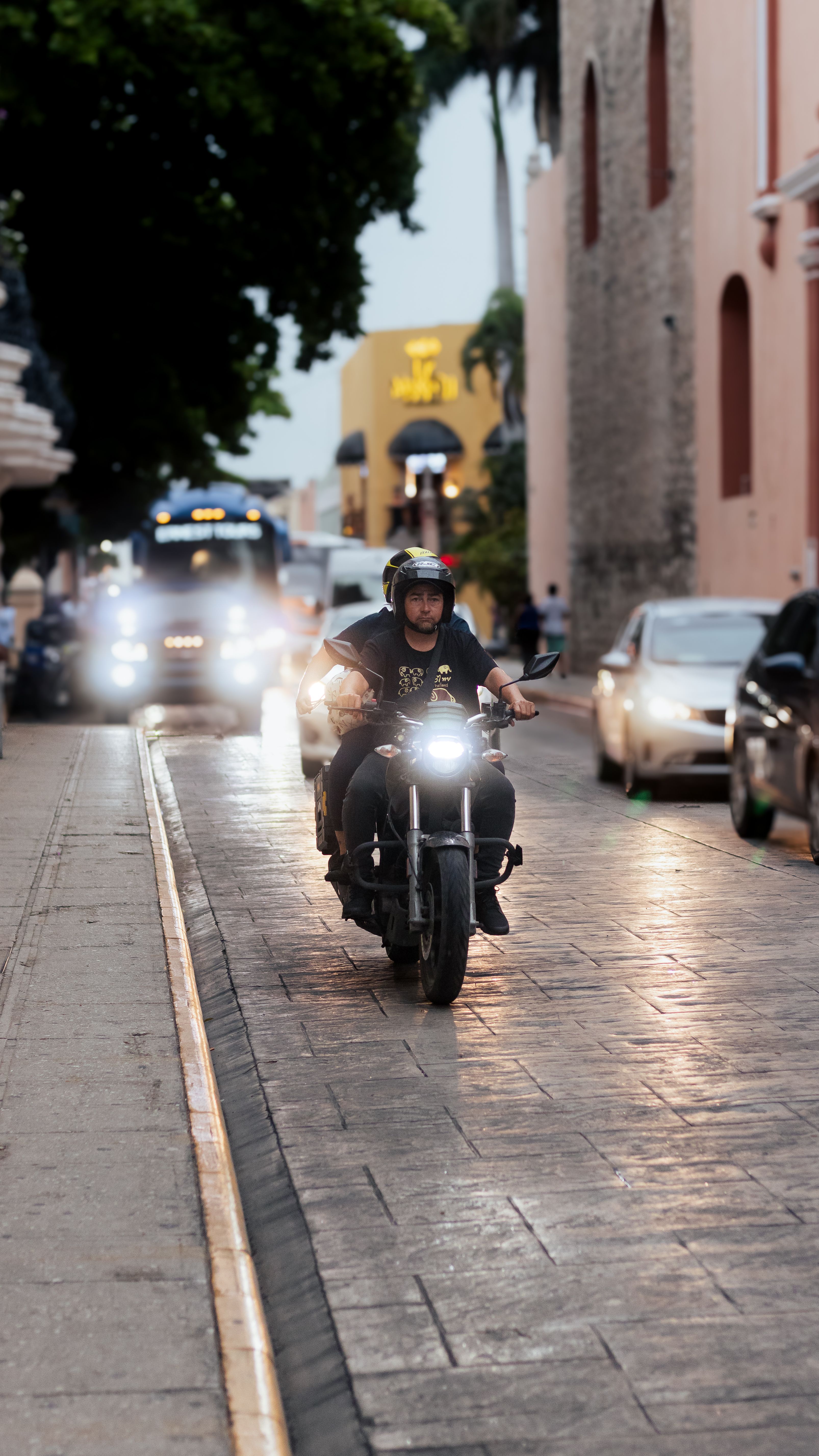 Biker Riding in front of other Cars · Free Stock Photo