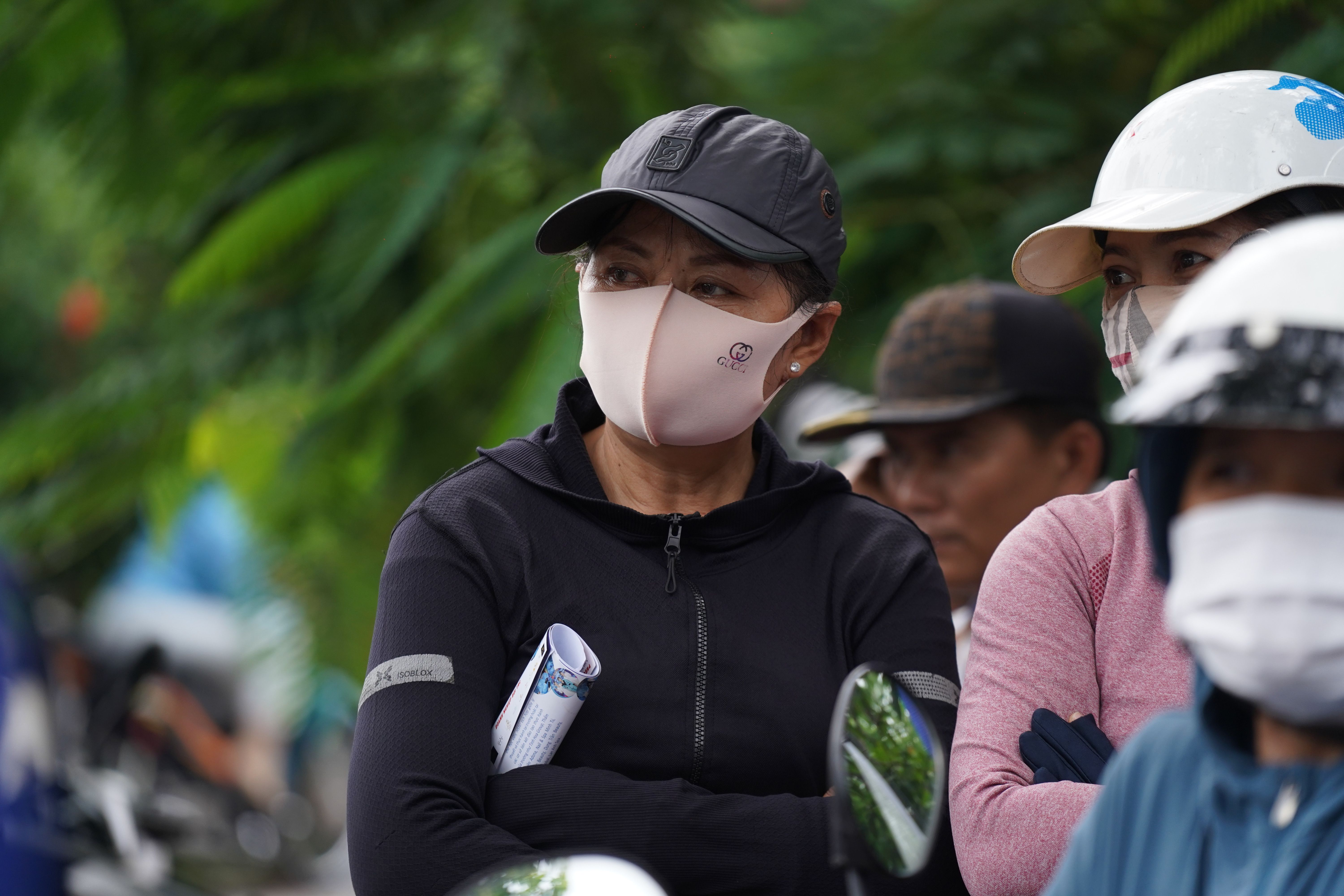 Woman in Baseball Cap and Surgical Mask on Face · Free Stock Photo