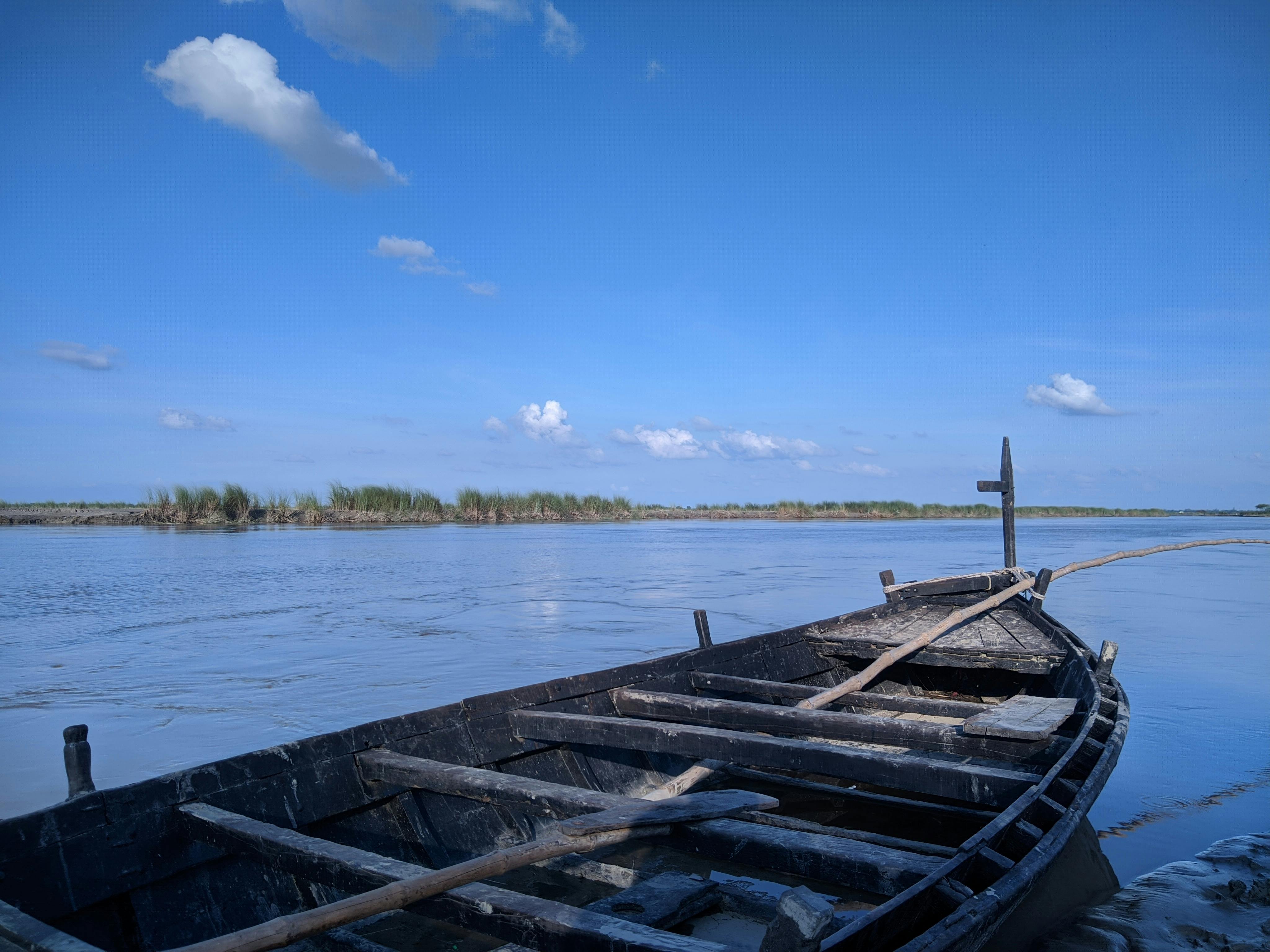 Wooden Boat Moored on River · Free Stock Photo