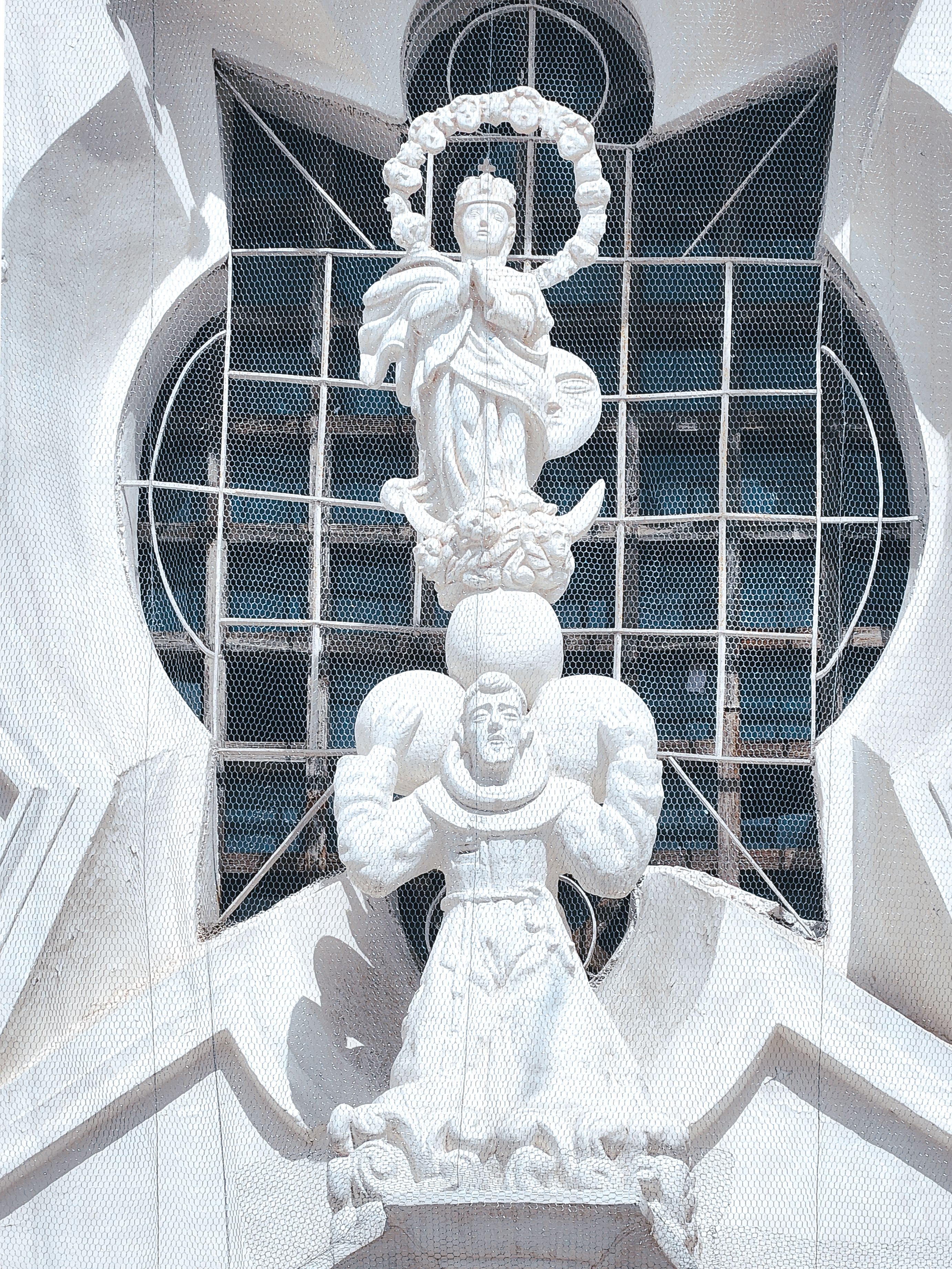 Close-up of Statues above the Entrance to the Basilica of Ocotlan ...