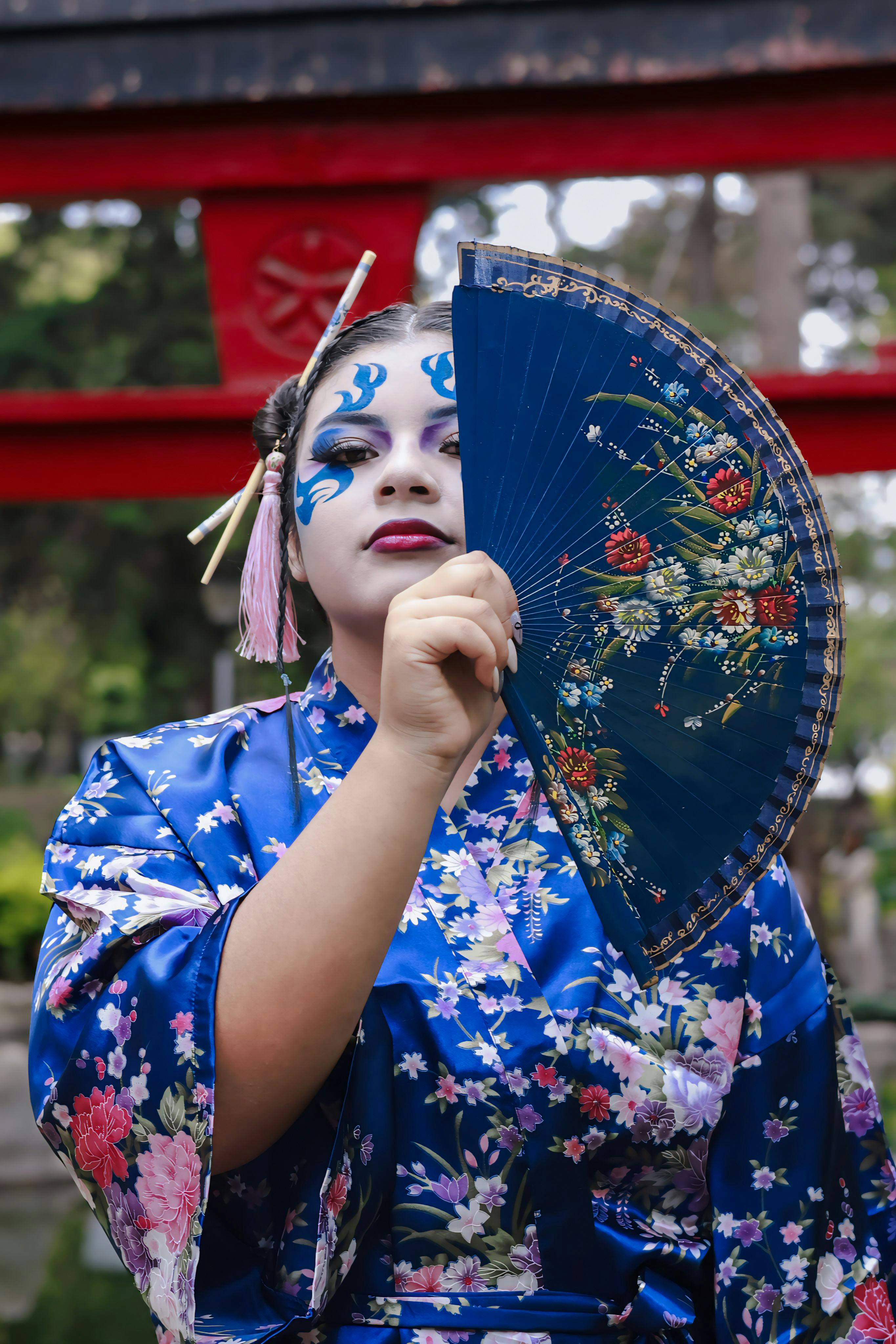 Beautiful Geisha Posing with Blue Hand Fan · Free Stock Photo