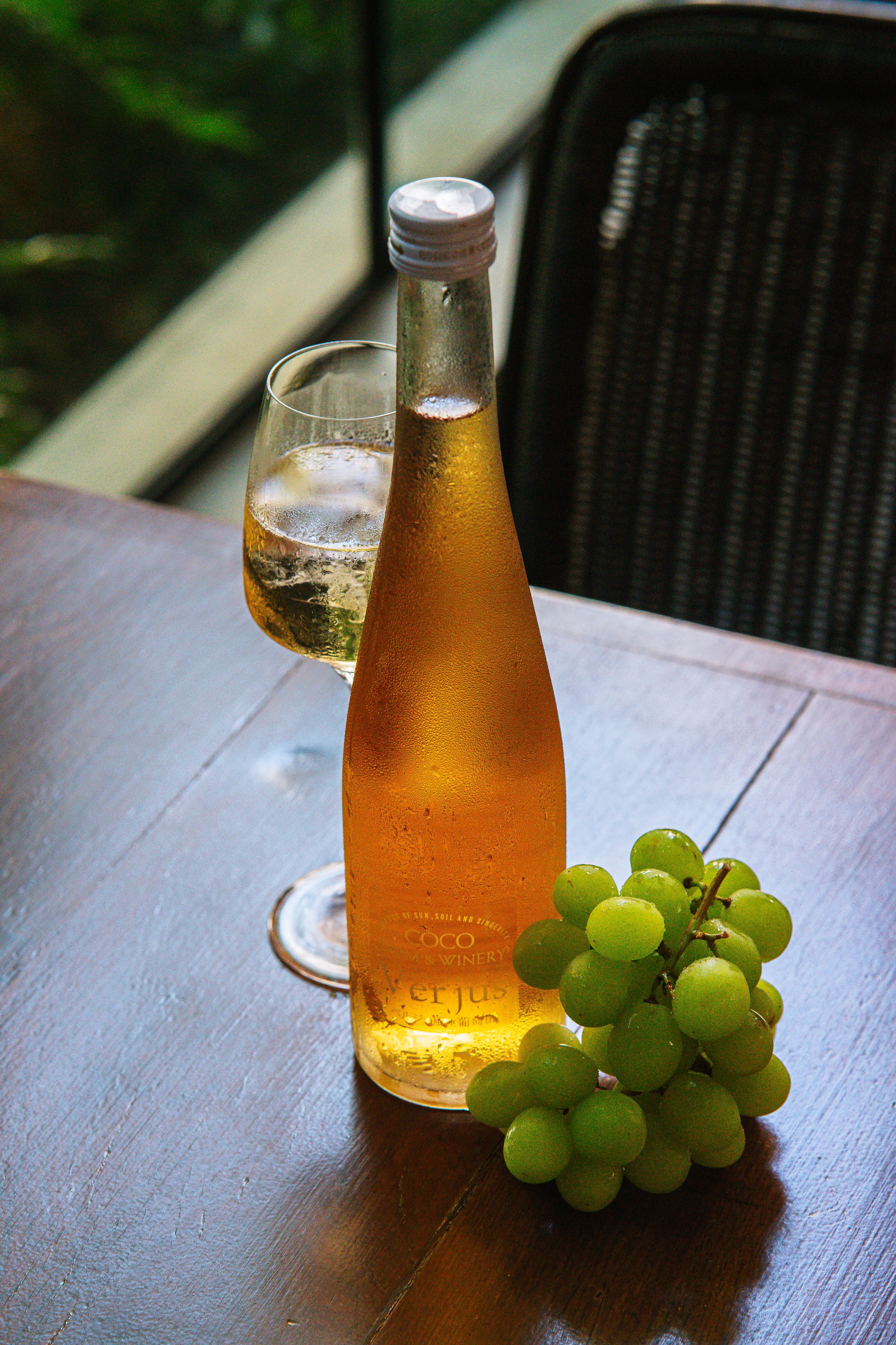 High Angle View of an Alcohol Bottle and Glass · Free Stock Photo