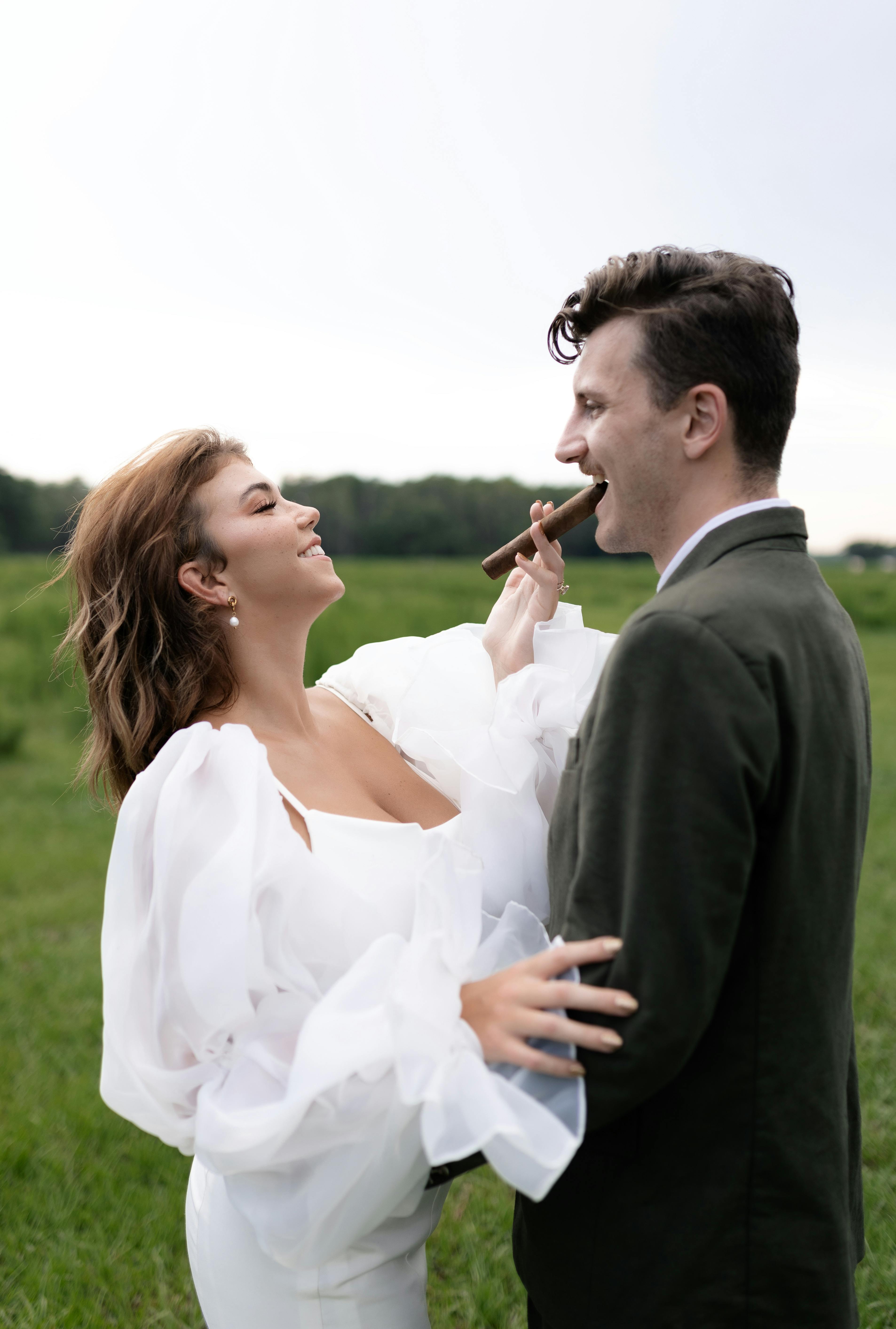 Bride Giving the Groom a Cigar · Free Stock Photo