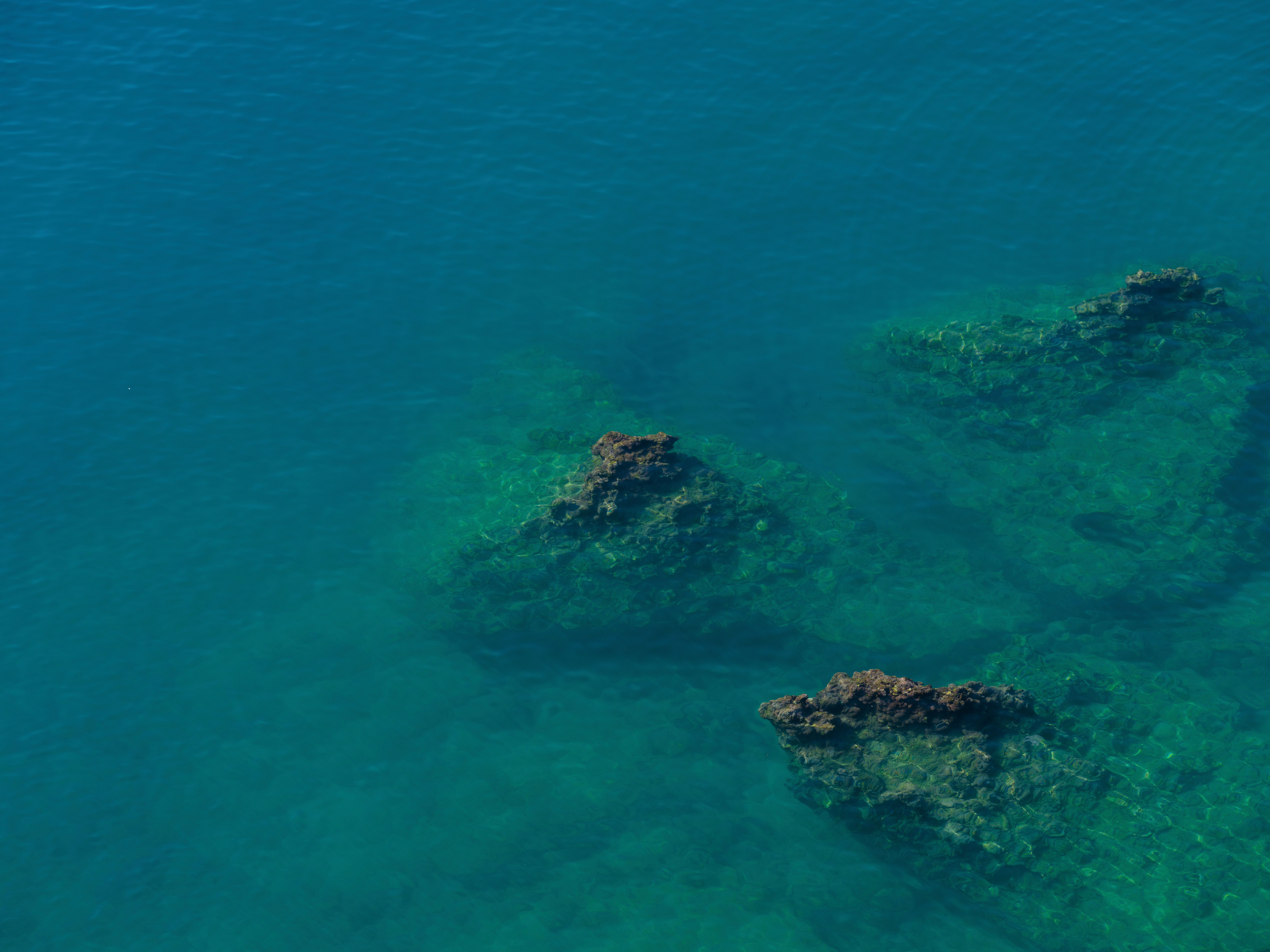 Rough Rocks Sticking Out of Sea Water · Free Stock Photo