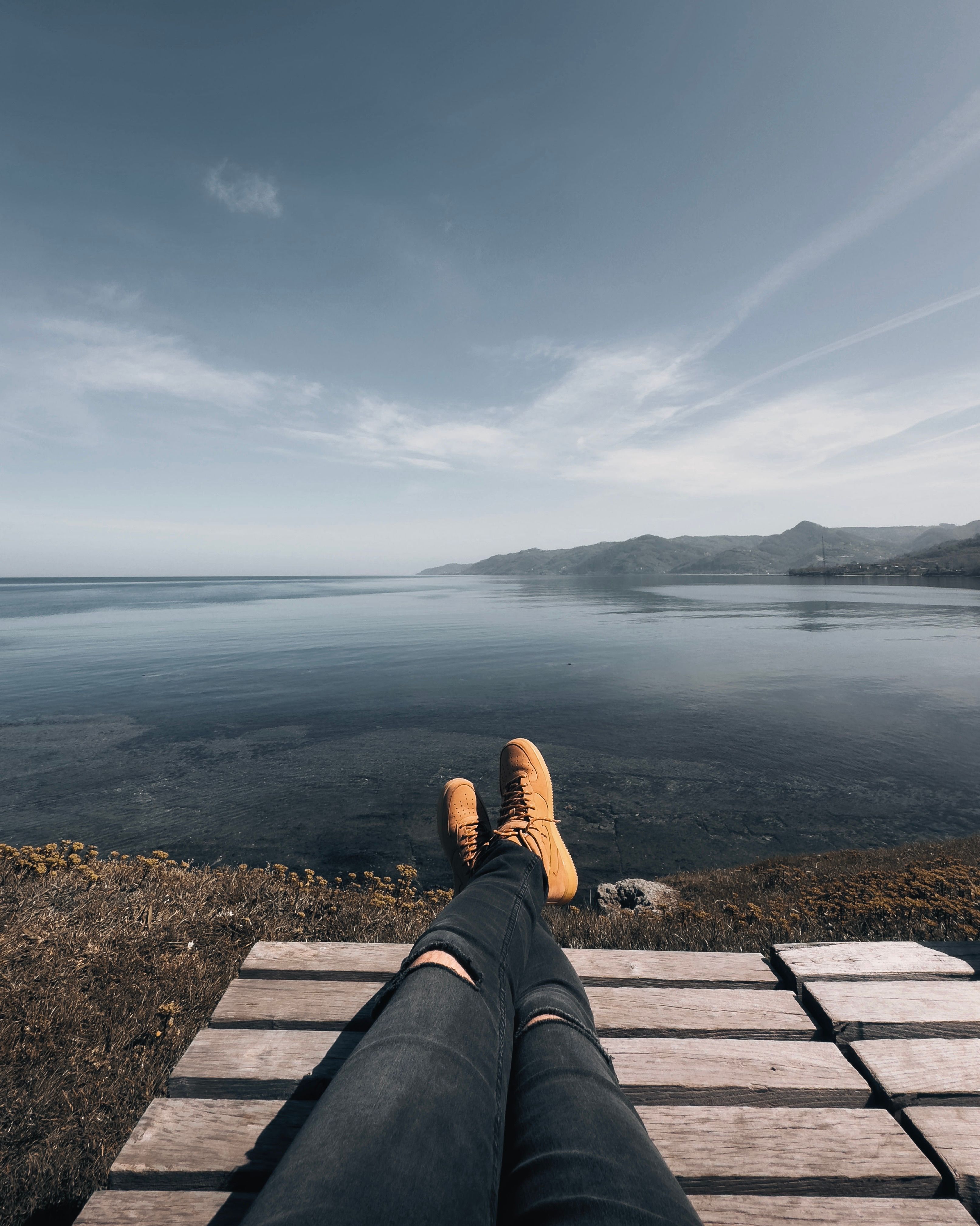 First Person Perspective Shot of a Person Sitting on the Beach · Free ...