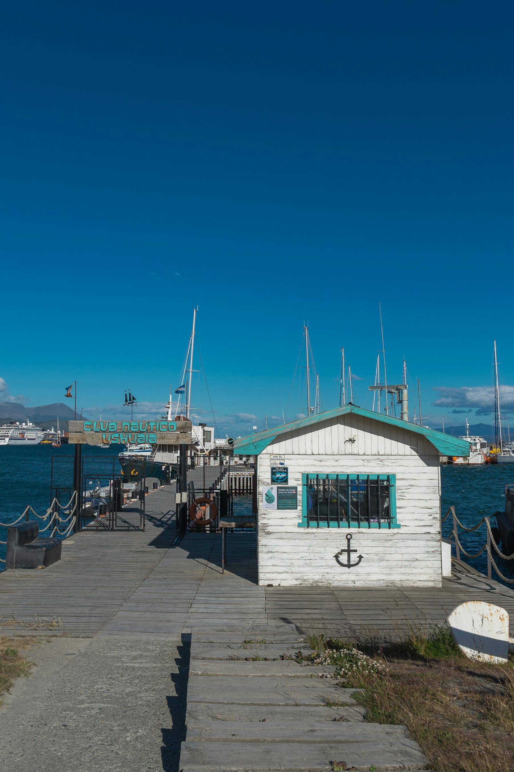 A small boat dock with a small building on it · Free Stock Photo