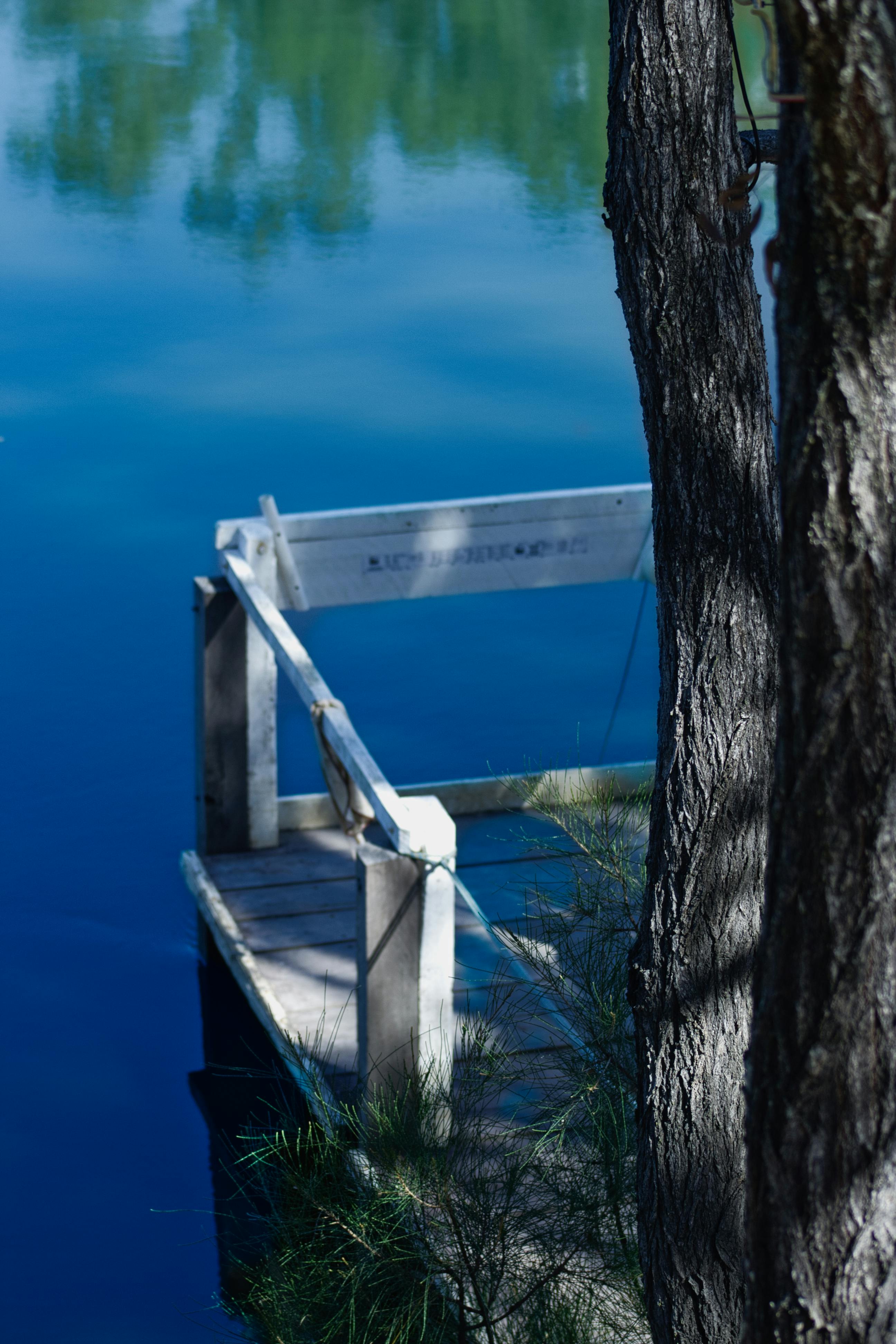 white jetty on a blue green river · Free Stock Photo