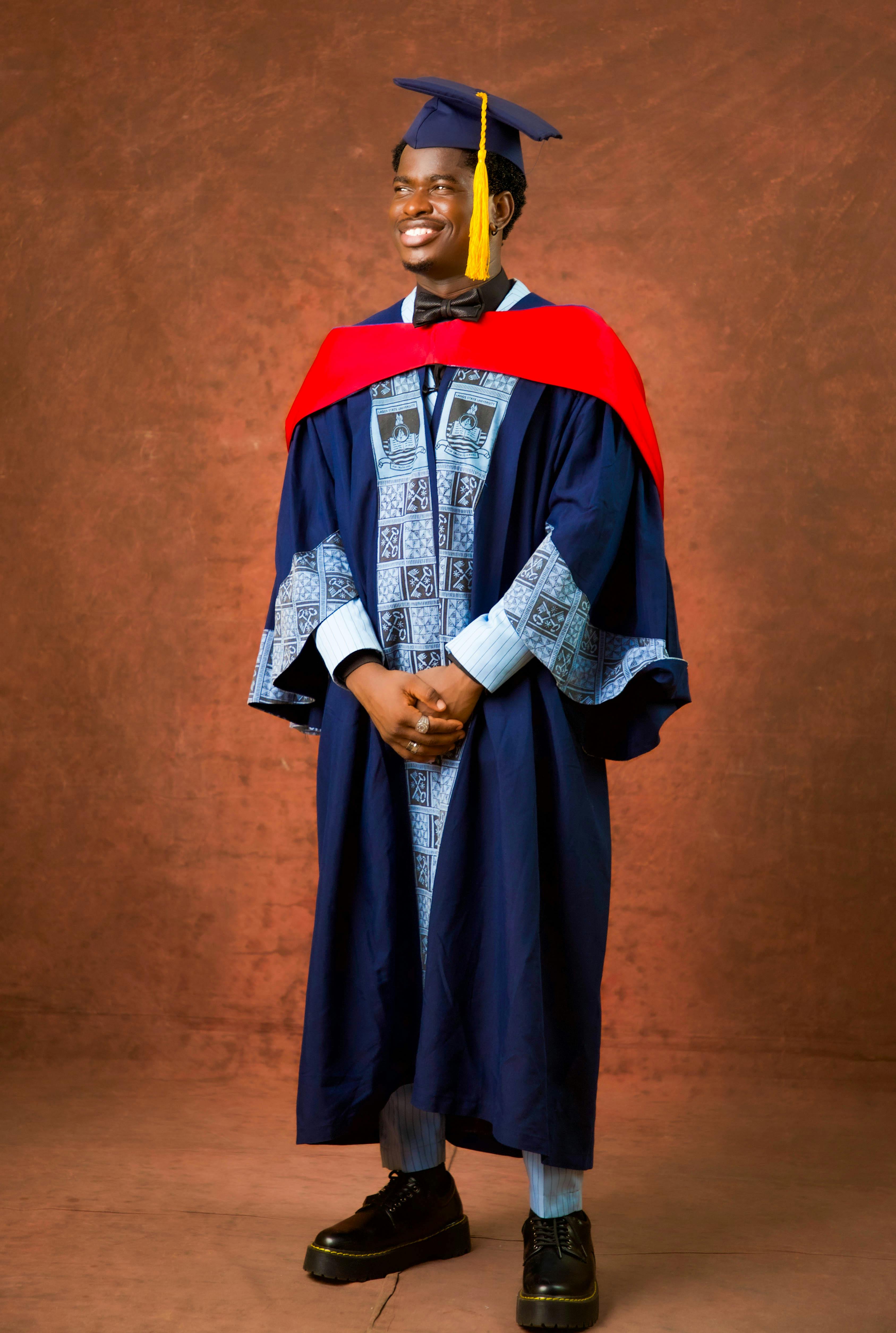 Young Graduating Man in a Gown and a Cap · Free Stock Photo
