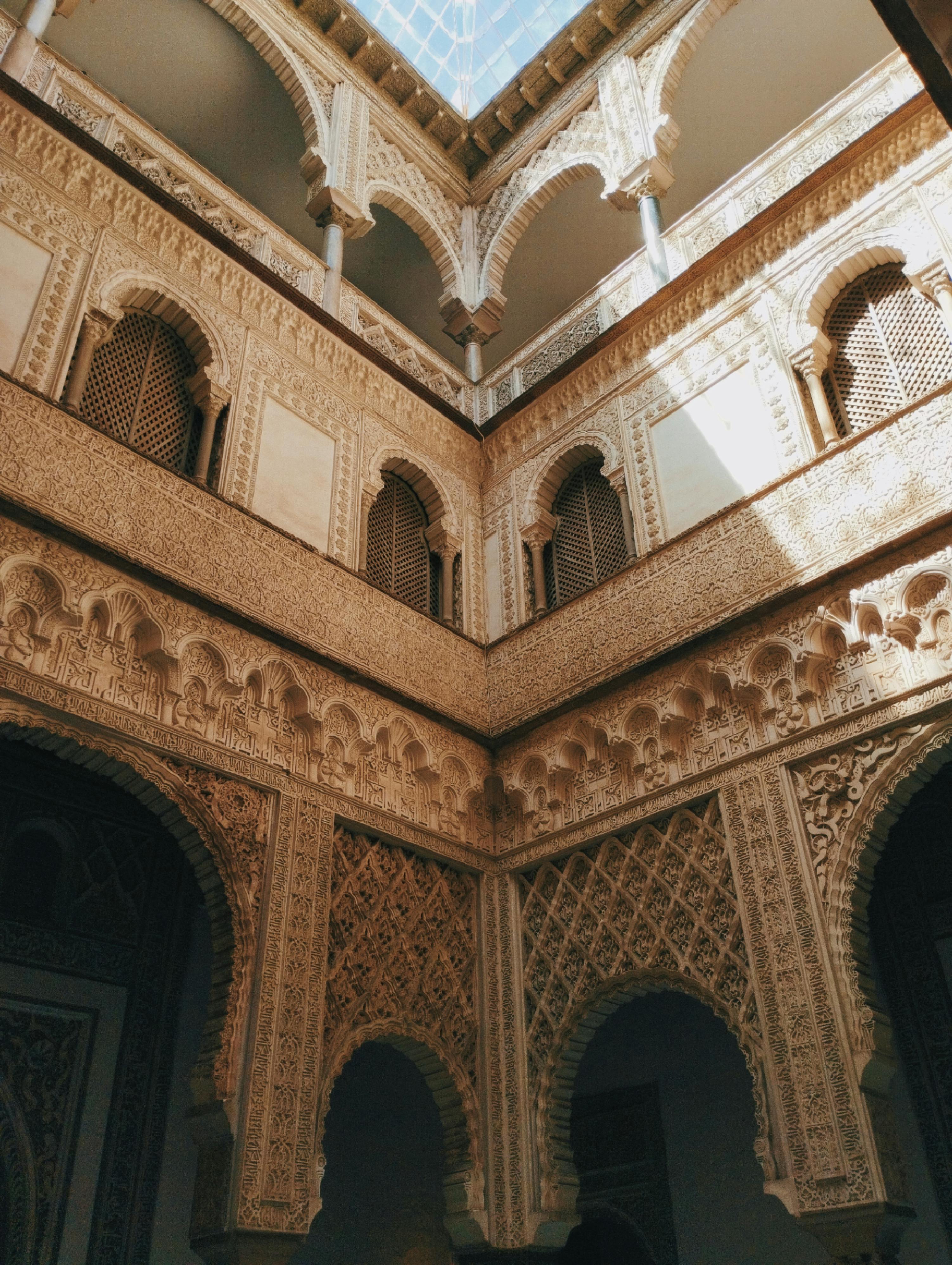 The inside of an arched building with a skylight · Free Stock Photo