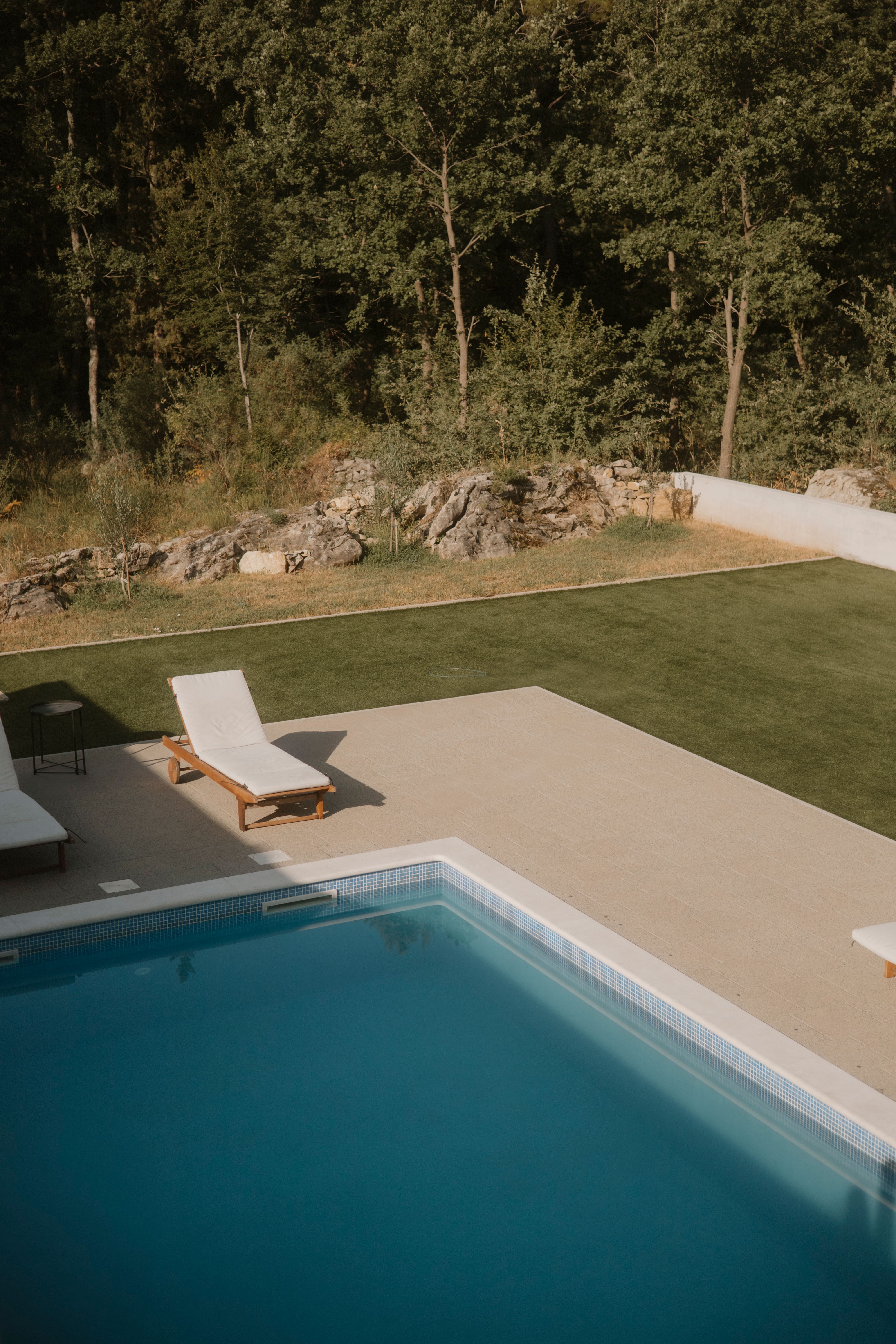 Sun Loungers by the Pool Near the Forest · Free Stock Photo