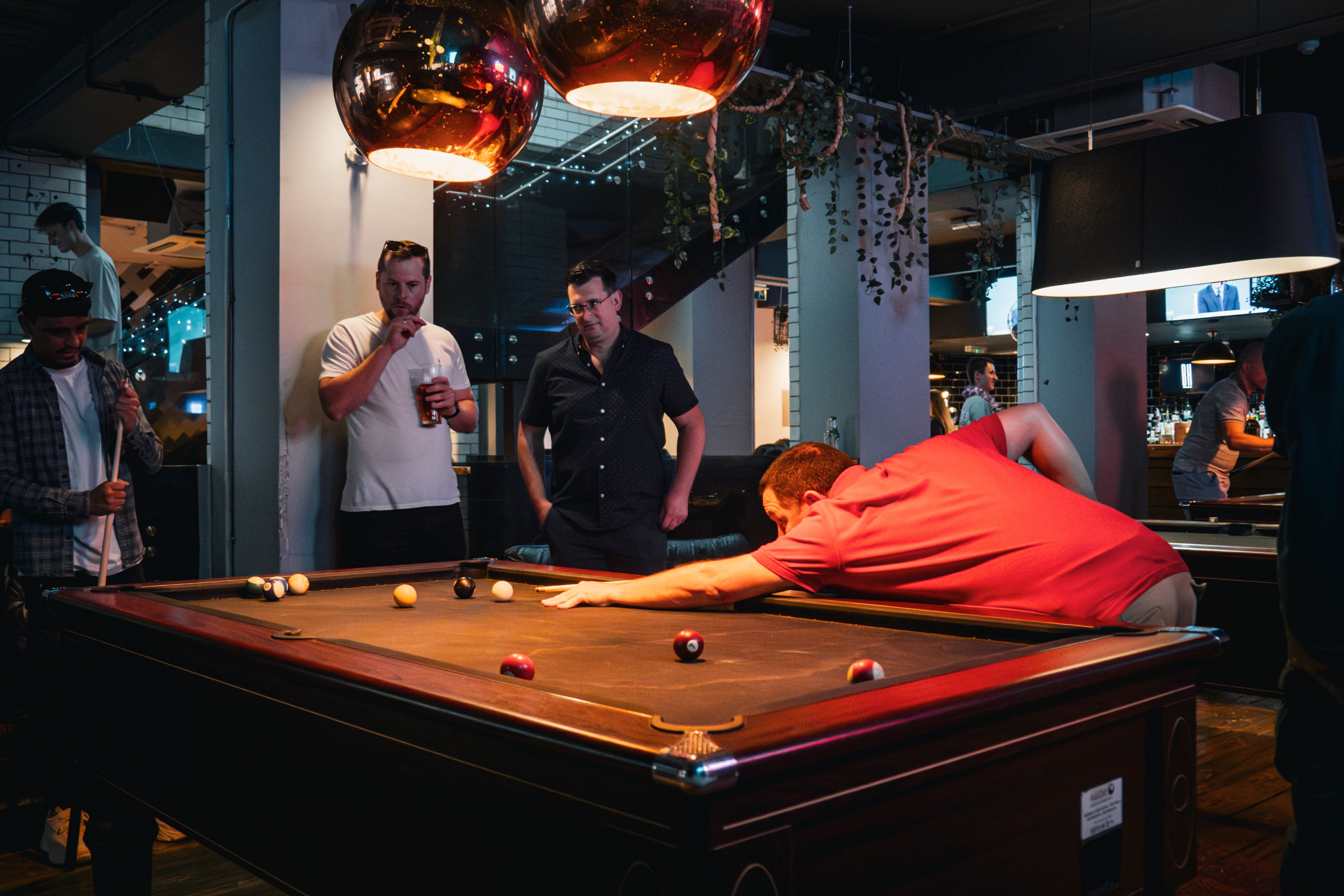 Men Playing Pool in the Bar · Free Stock Photo